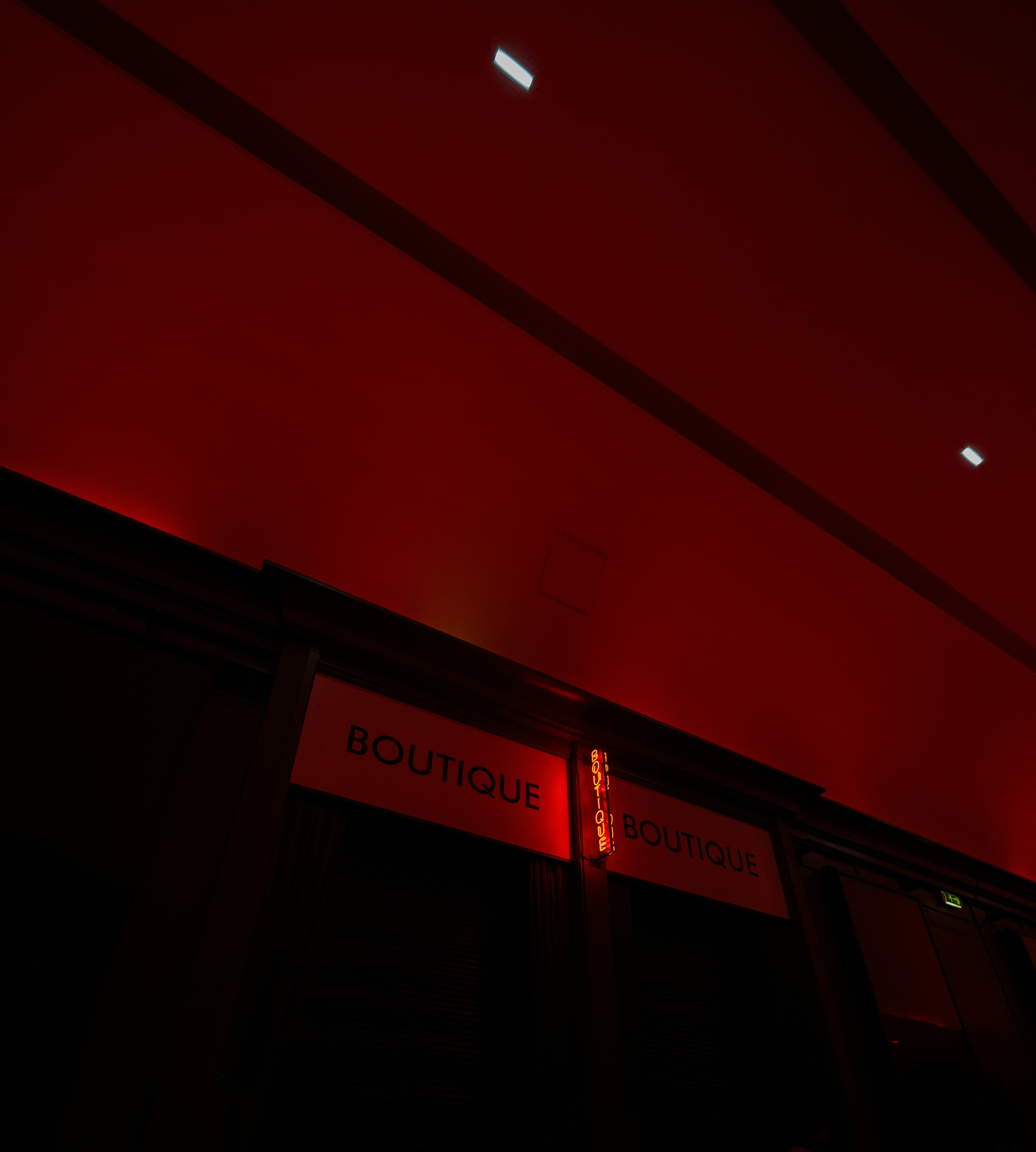 Red Neon Between Boutique Doors