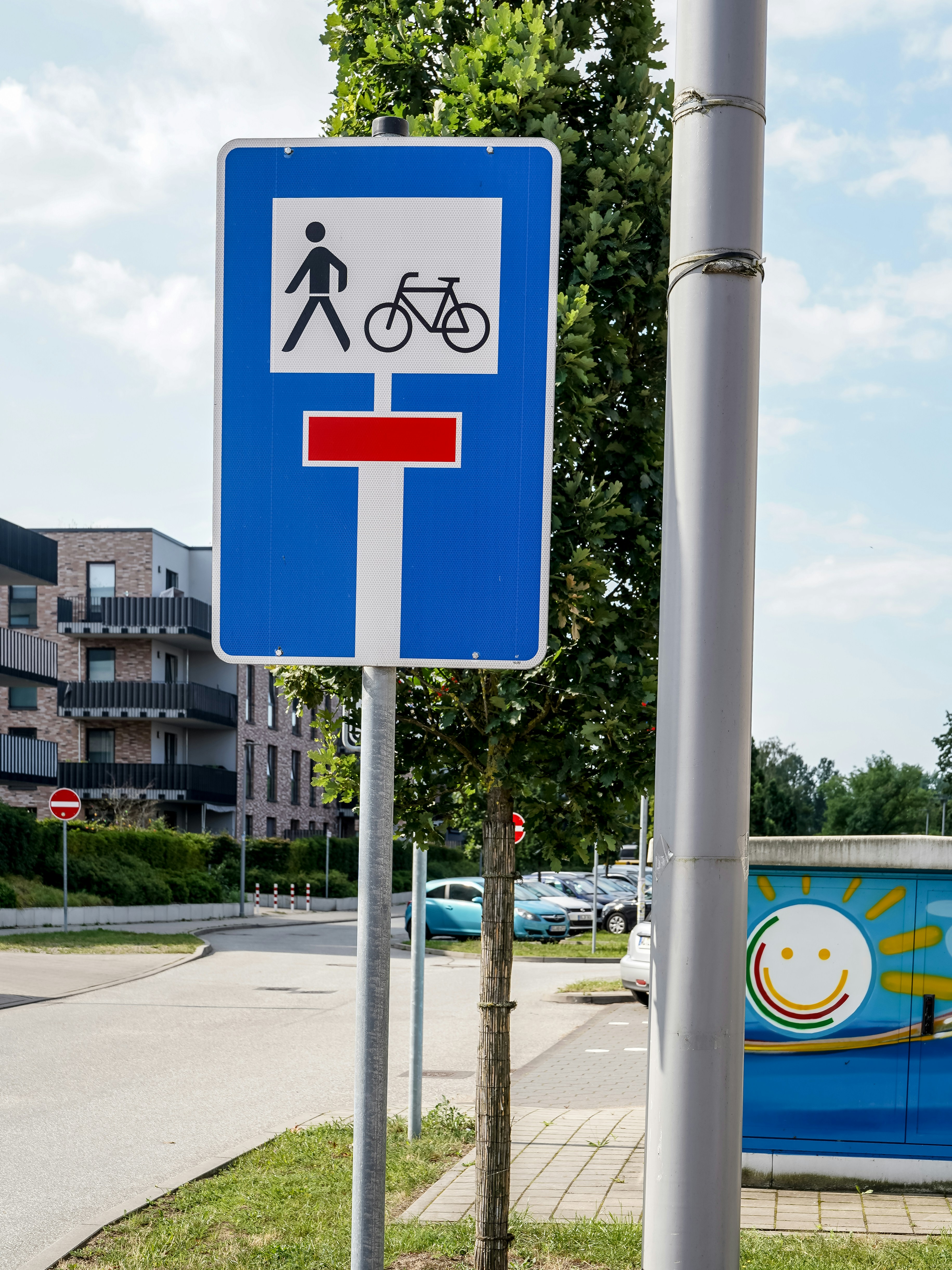 Blue Pedestrian-Bicycle Sign Signifying a Dead-End Path Ahead