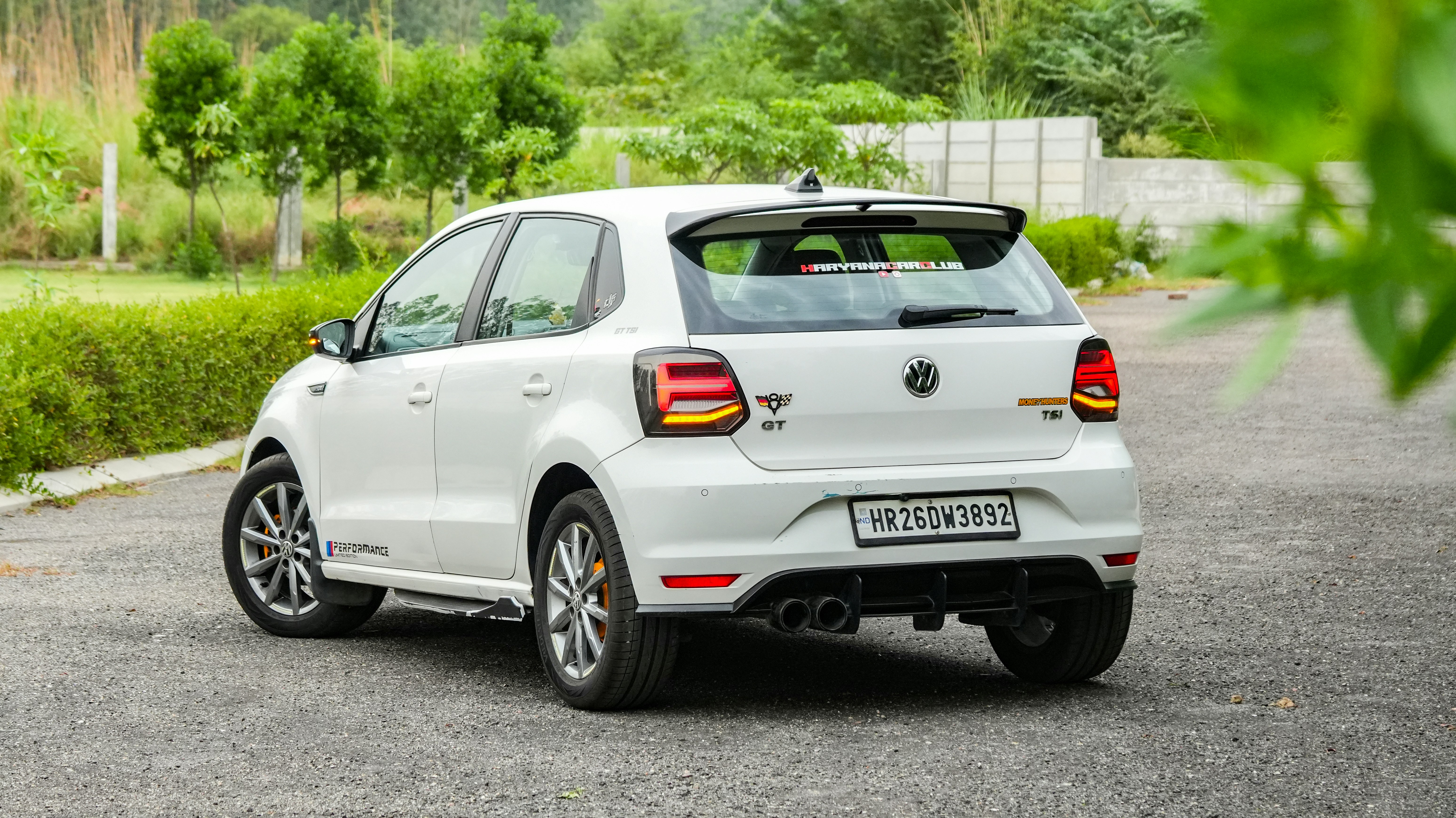 Rear-View GTI: White hatchback rests on a quiet driveway