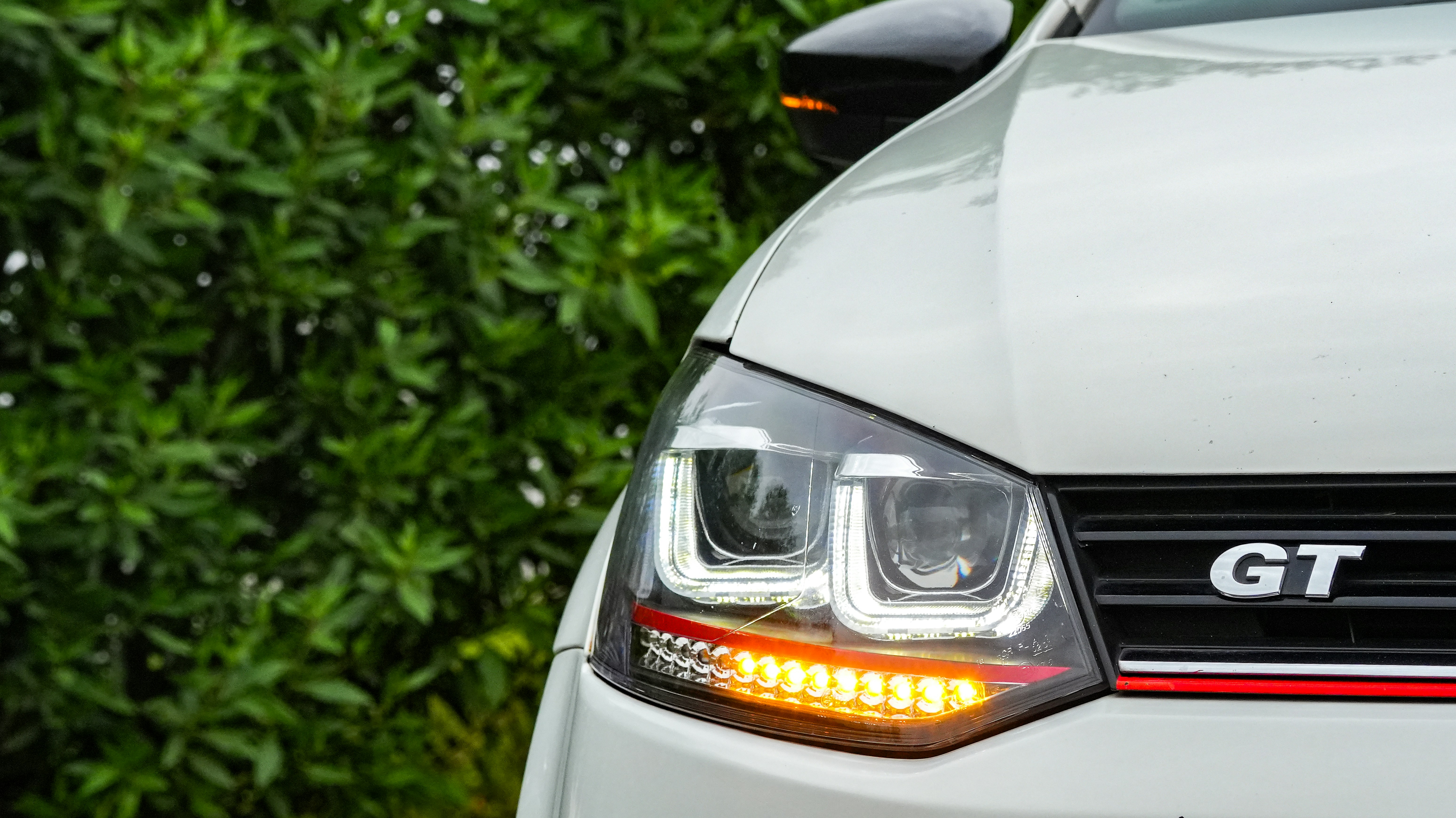 Front-Quarter Glance: A GT Badge and LED Wake