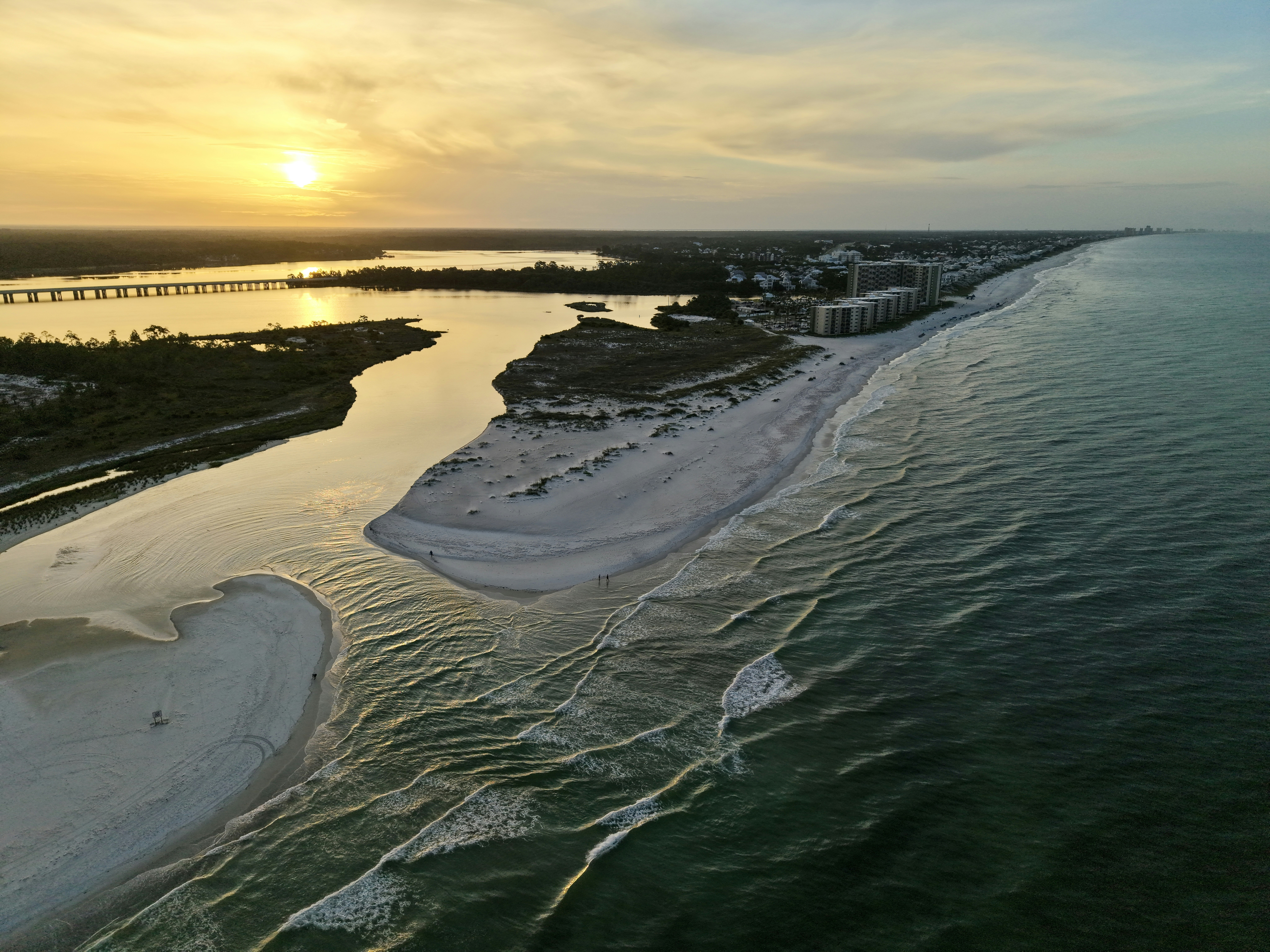 Sunlit Coastline: Aerial Vista Over Quiet White-Sand Dunes at Dusk