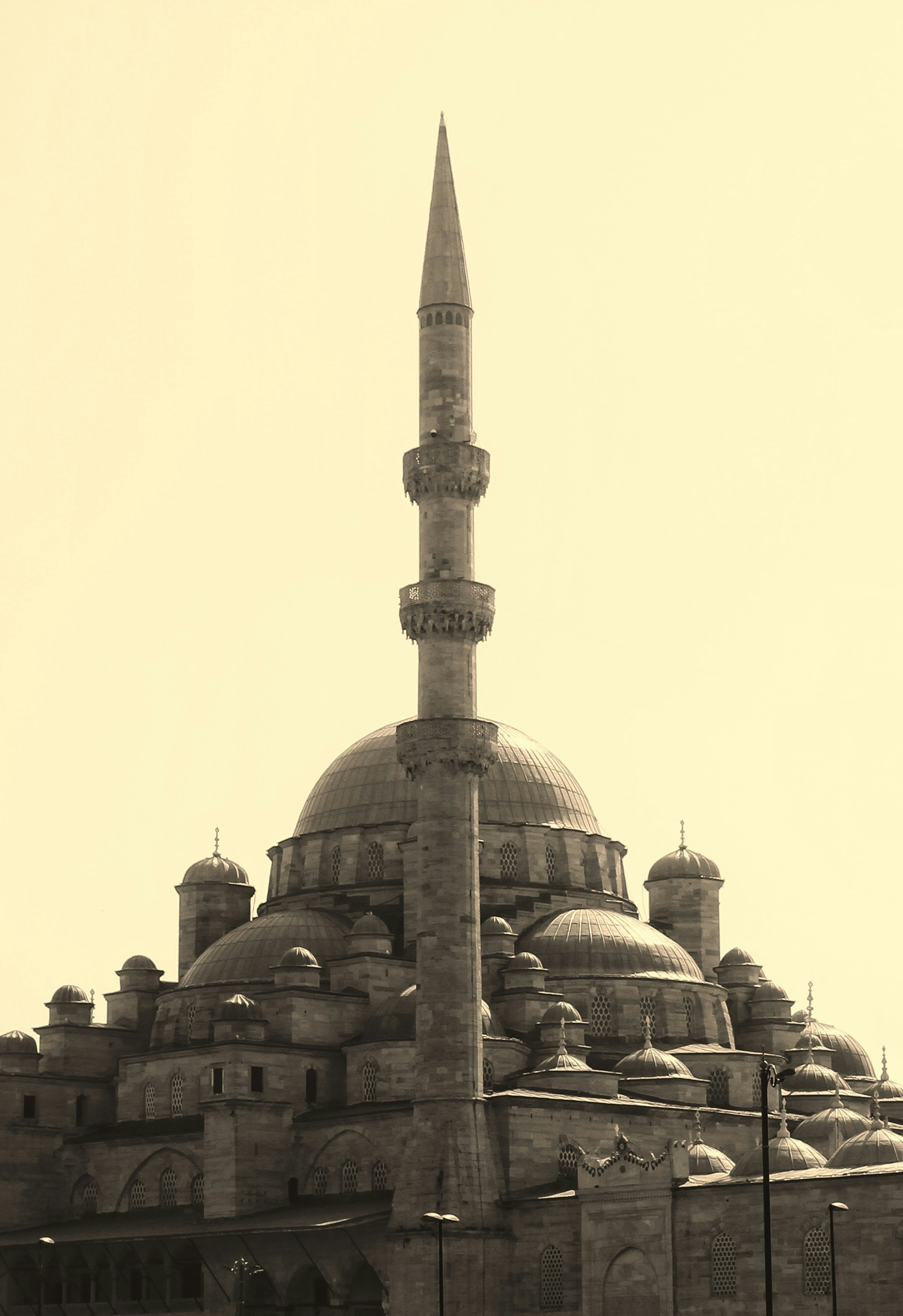 Minaret Crown: A Mosque Dominates the Skyline in Sepia