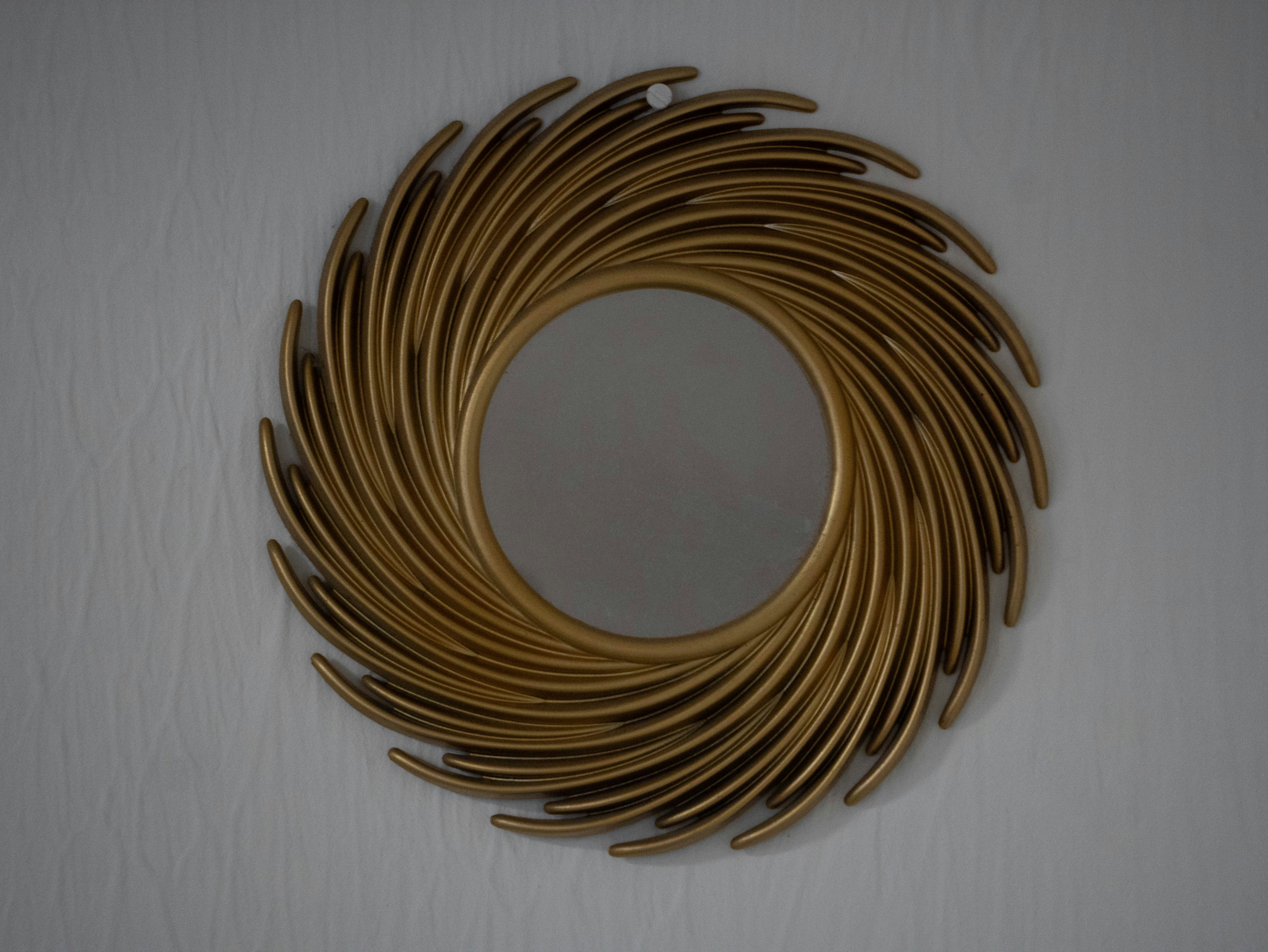 Golden Spiral Mirror: A Metallic Rosette as Centerpiece