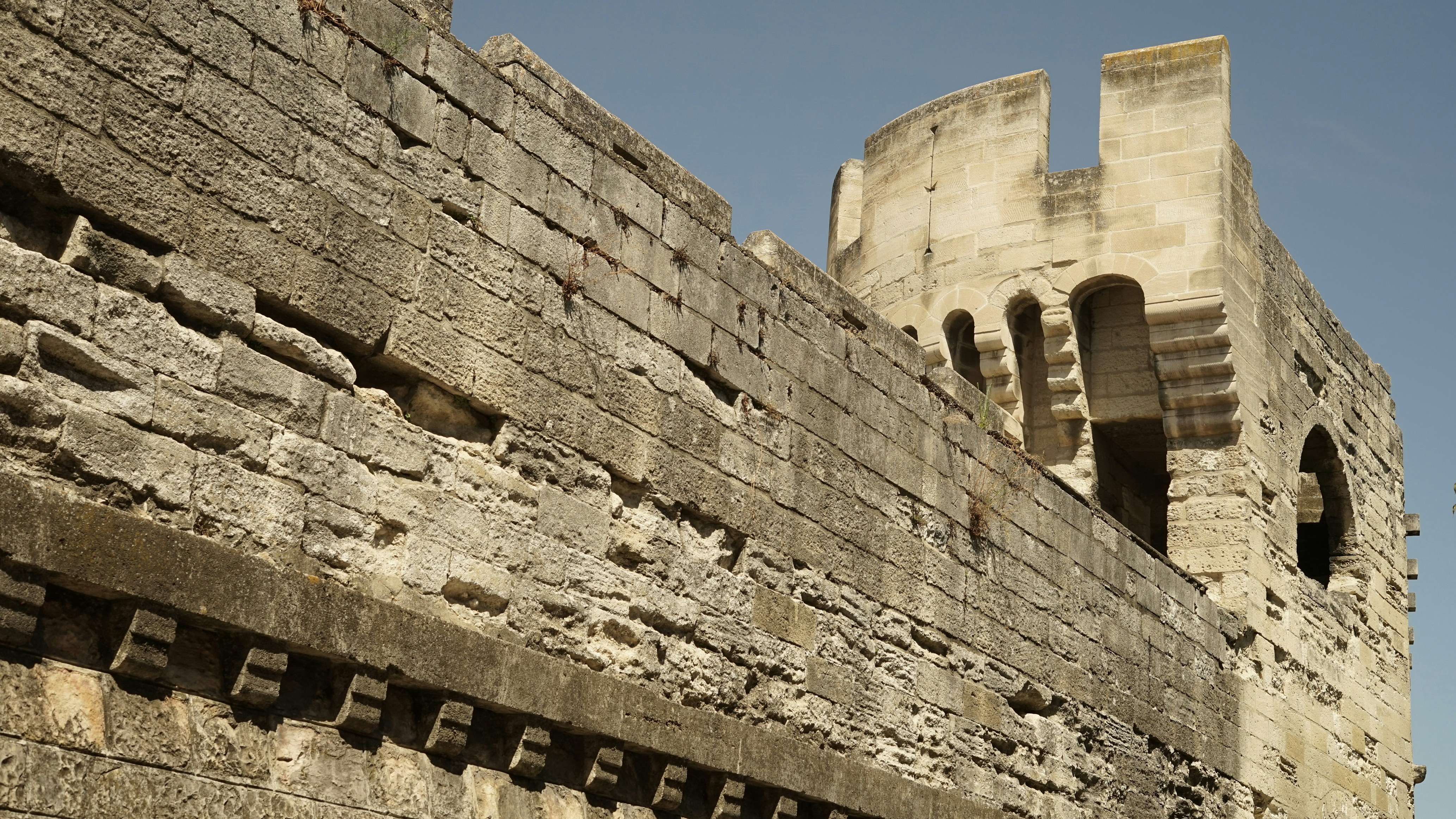 Stone Embrace: A Roman Amphitheater Corner Rising into the Sky