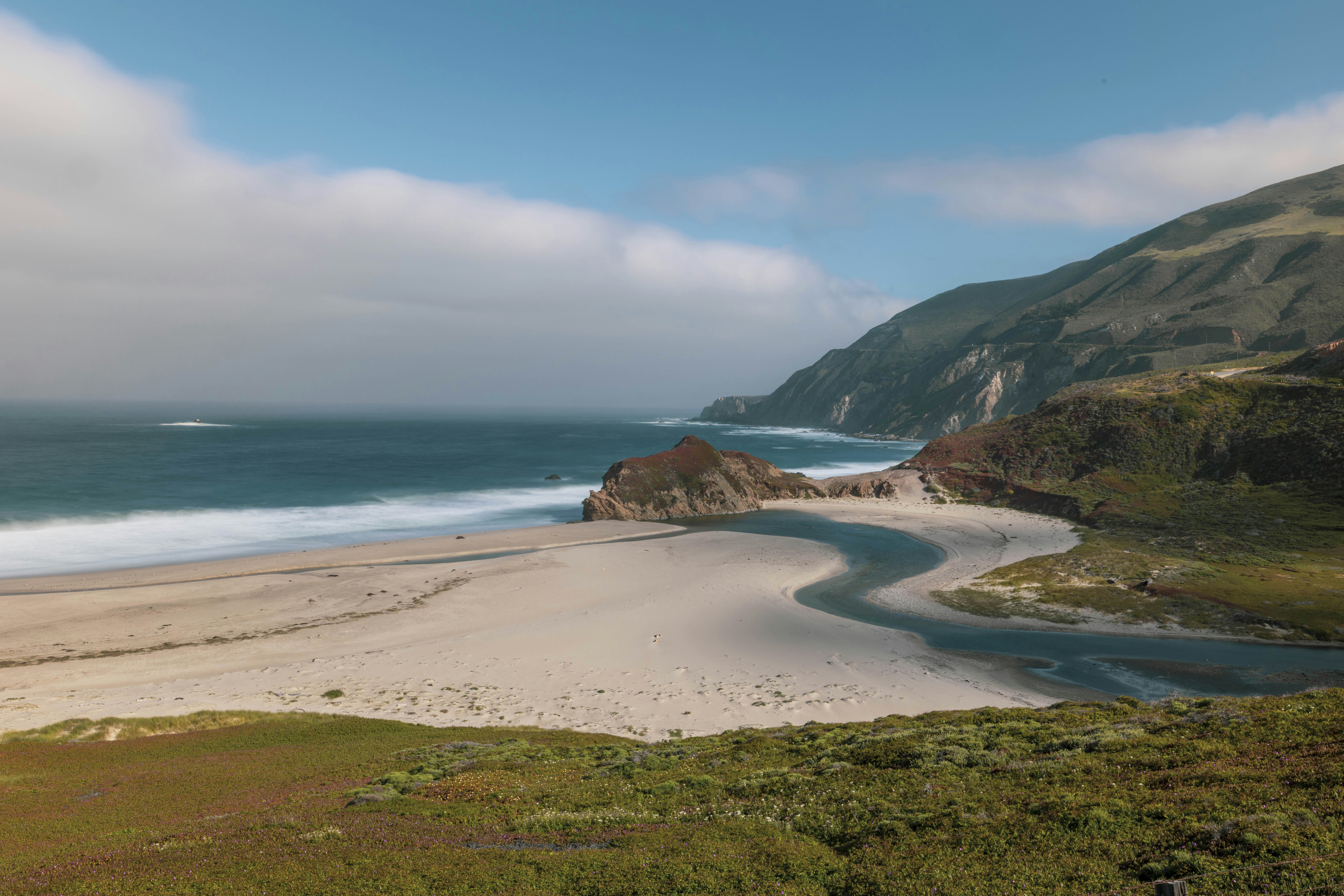 Coastal Whisper: Silent Beach Embraced by Cliffs at Dusk