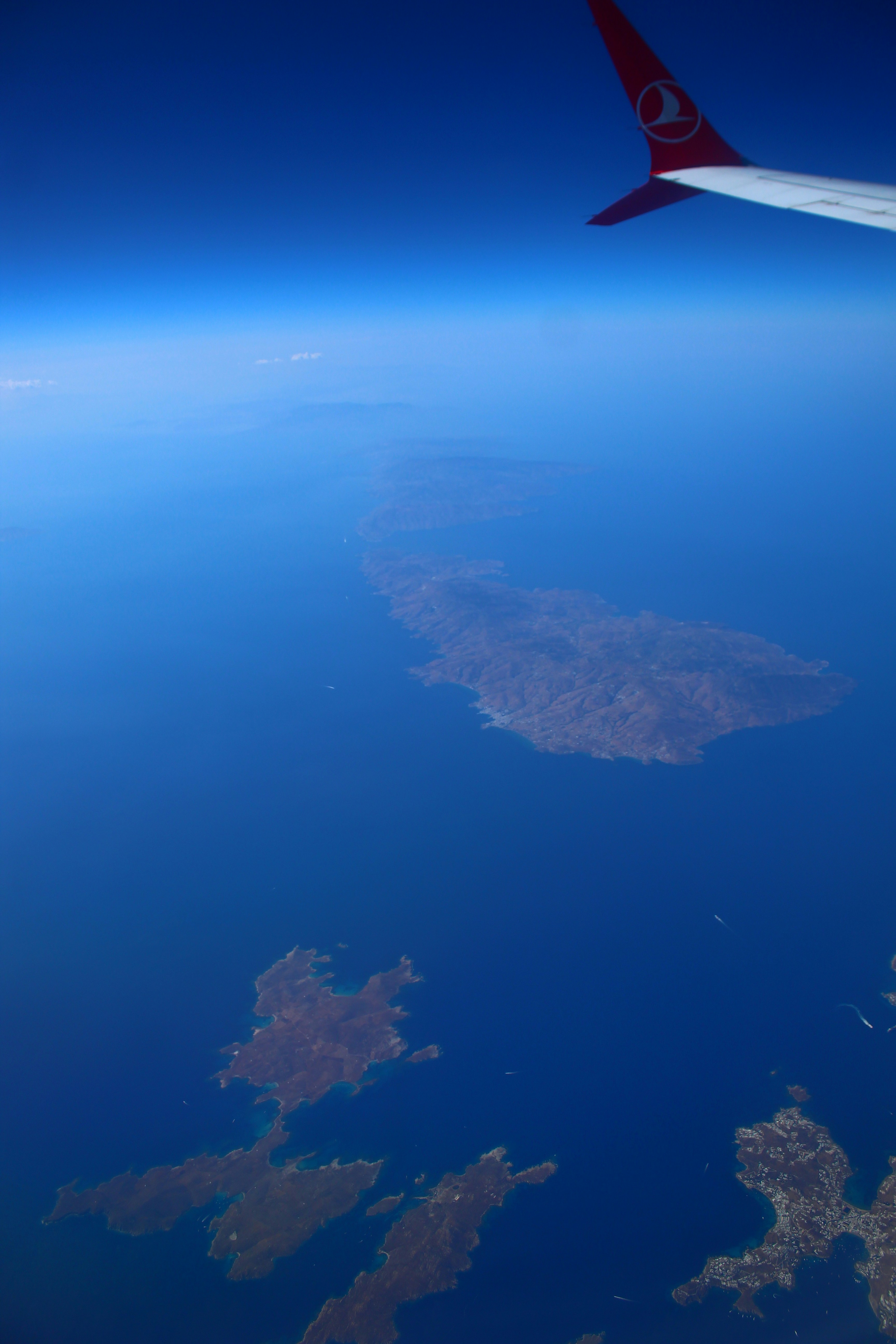 Over Atlantic: Wingtip Above an Island Arc
