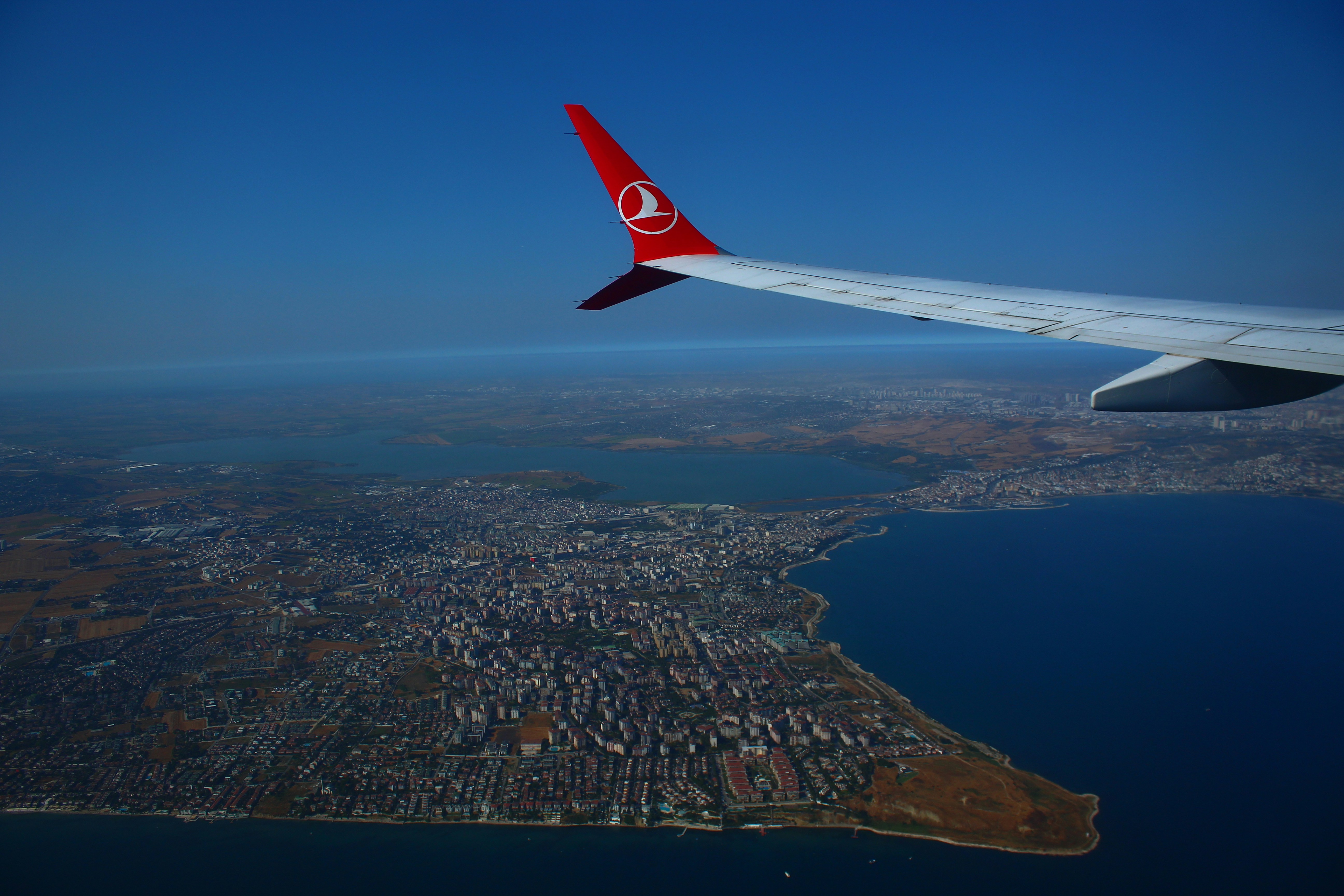 Wingtip Over Istanbul: Aerial View of Coastal Cityscape