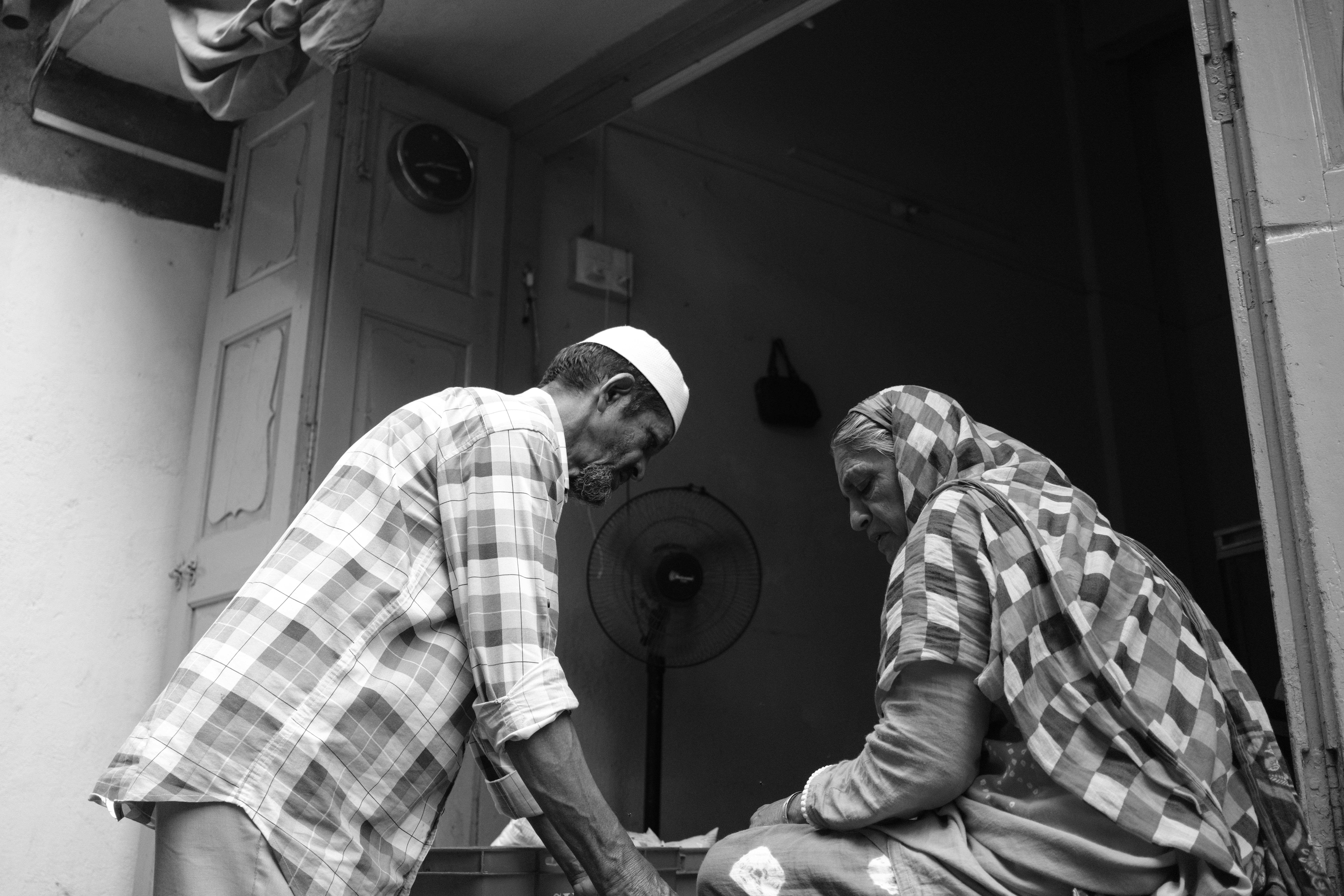 Hands in Work: A Moment of Shared Labor at a Threshold
