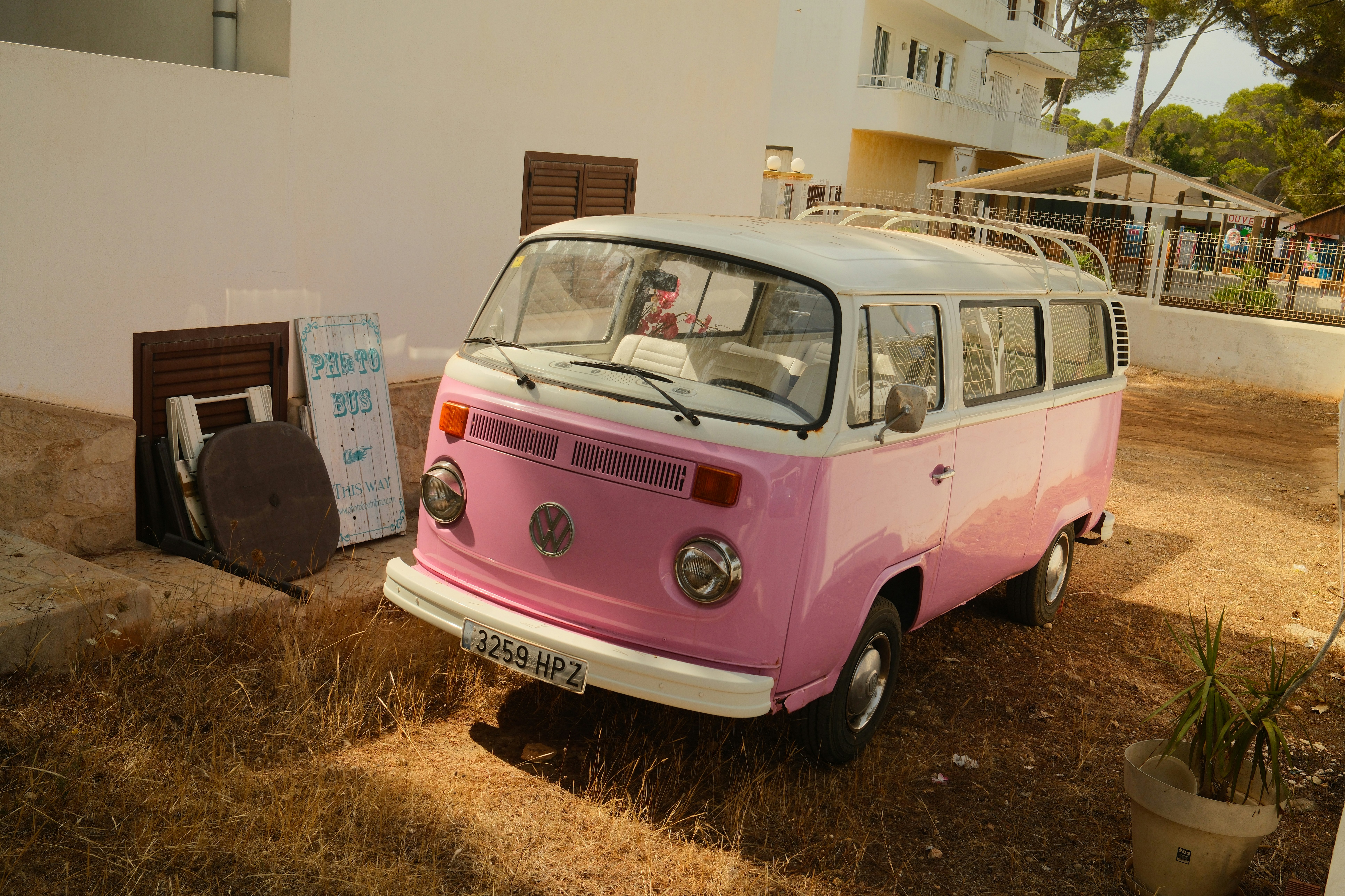 Pastel Bus by the White-walled Yard