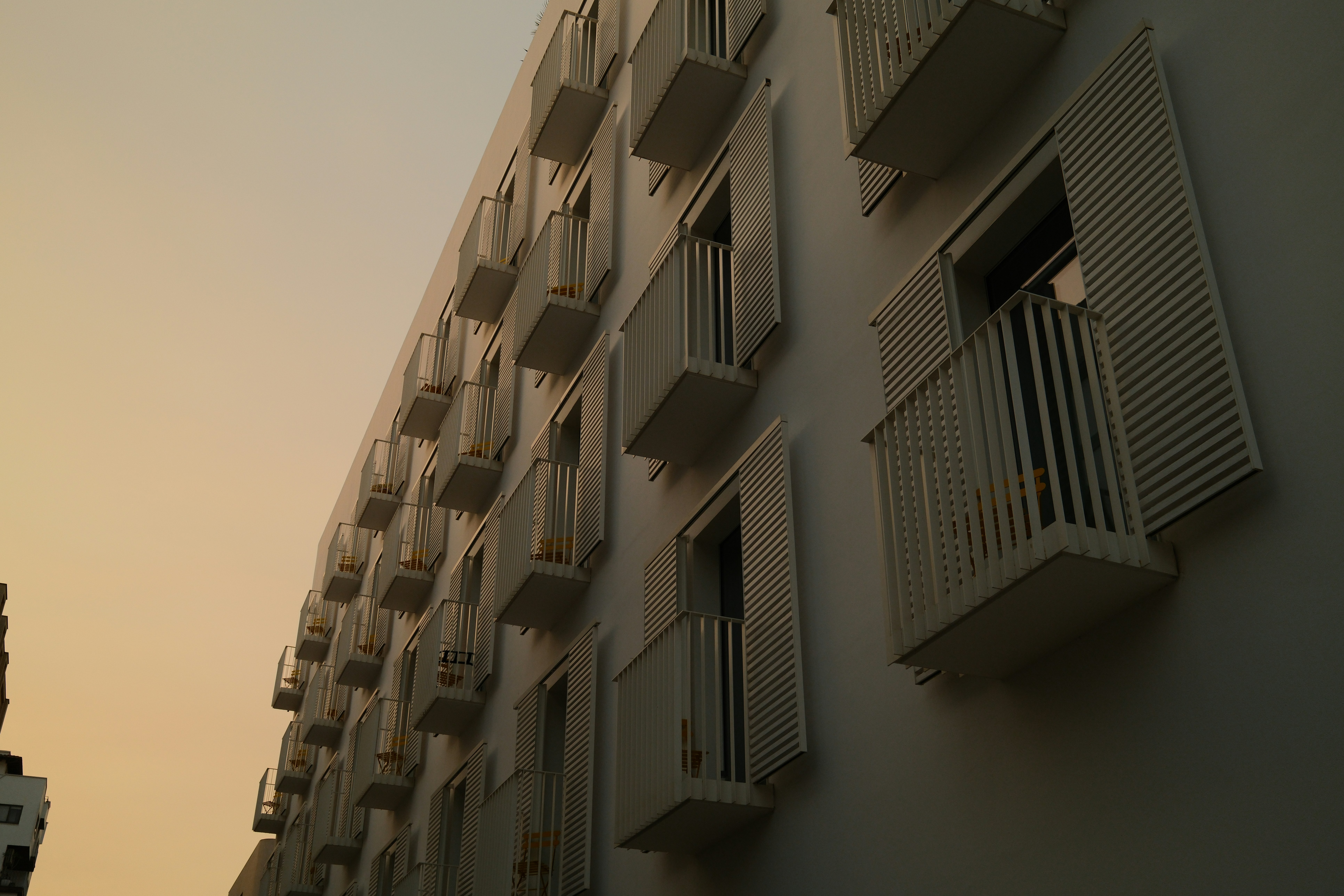Shadowed balconies in the golden hour rise