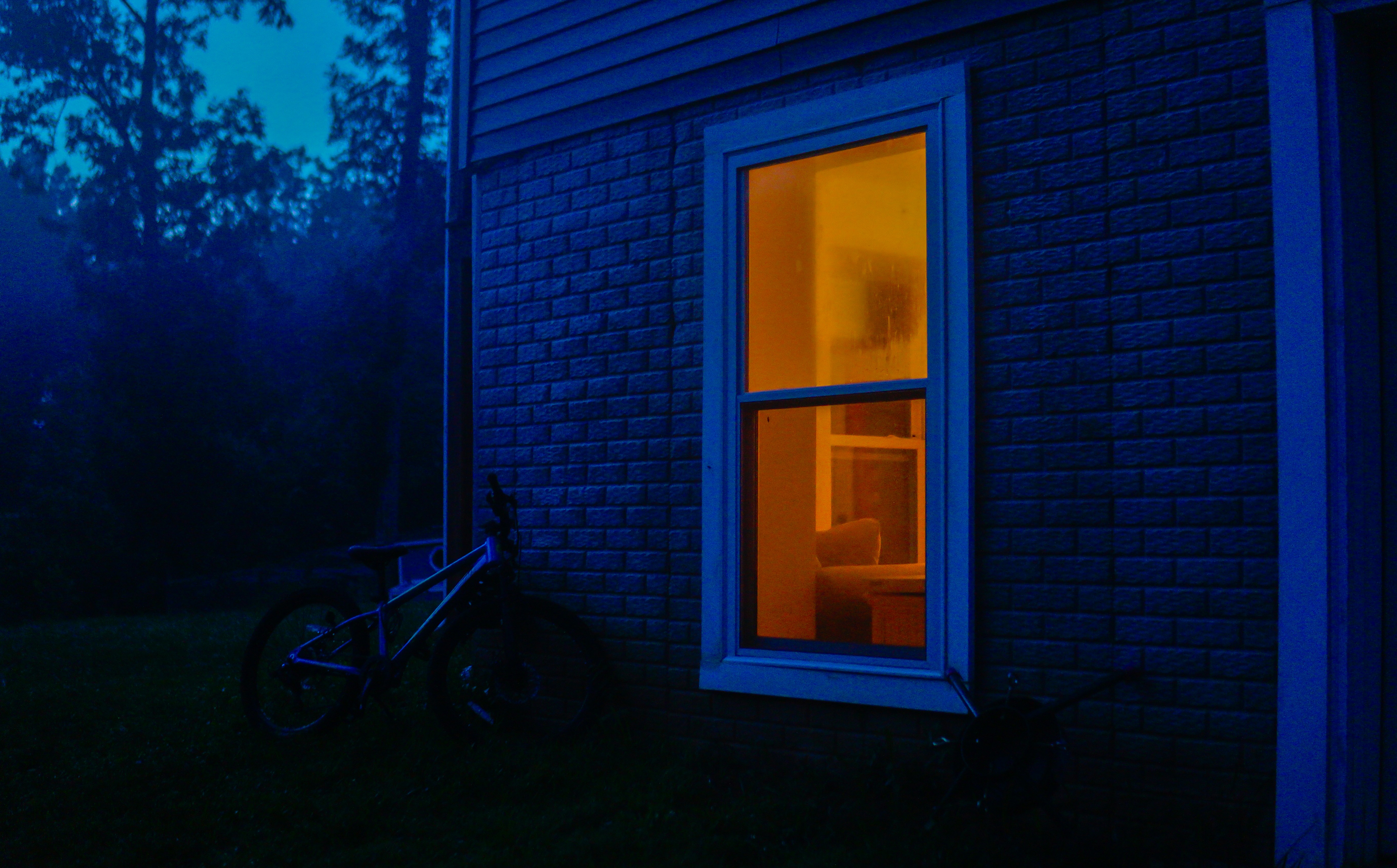 Warm Window Glow in a Quiet Night Exterior