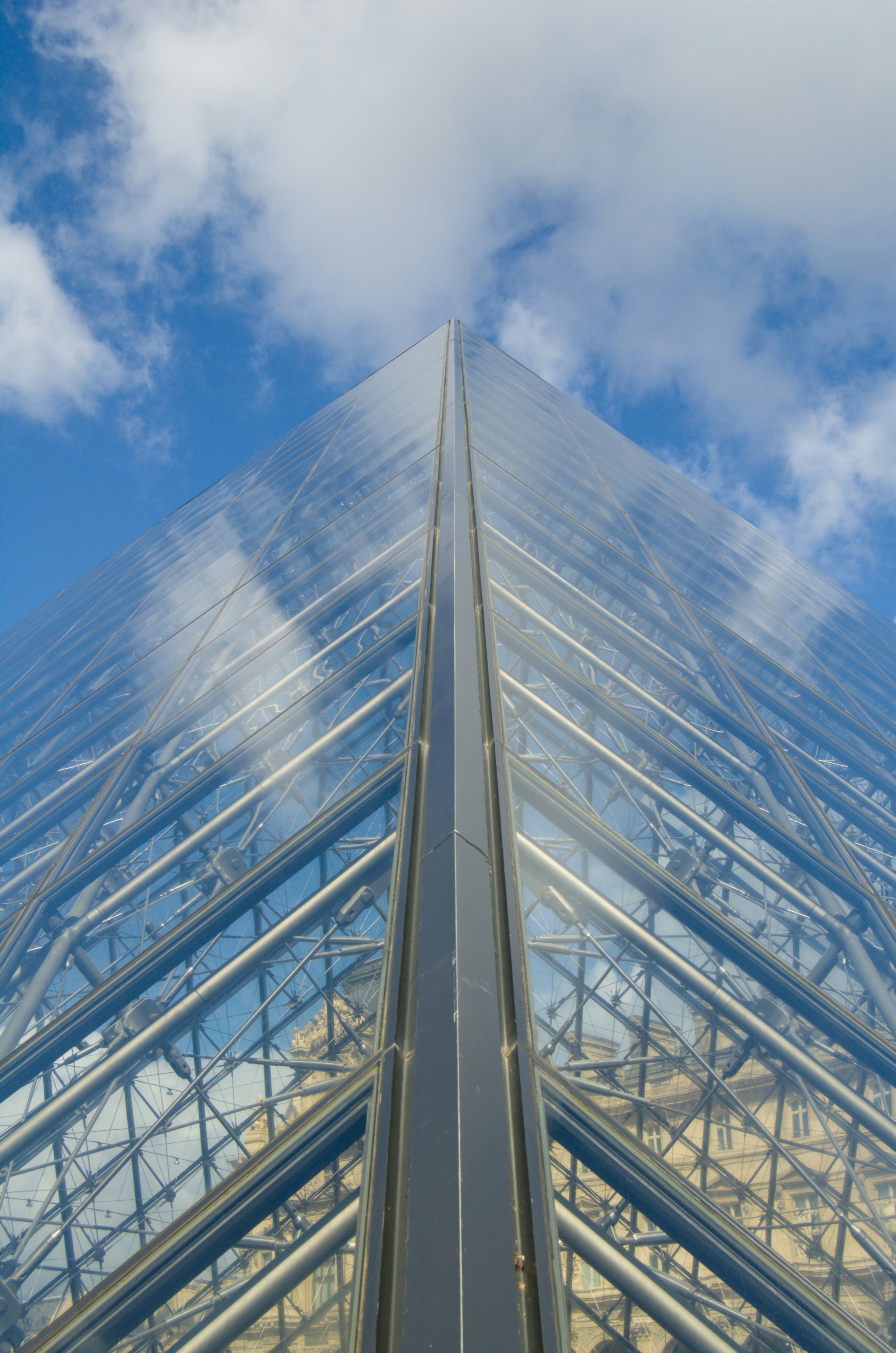 Skyward Symmetry: The Glass Spine Reaching the Clouds
