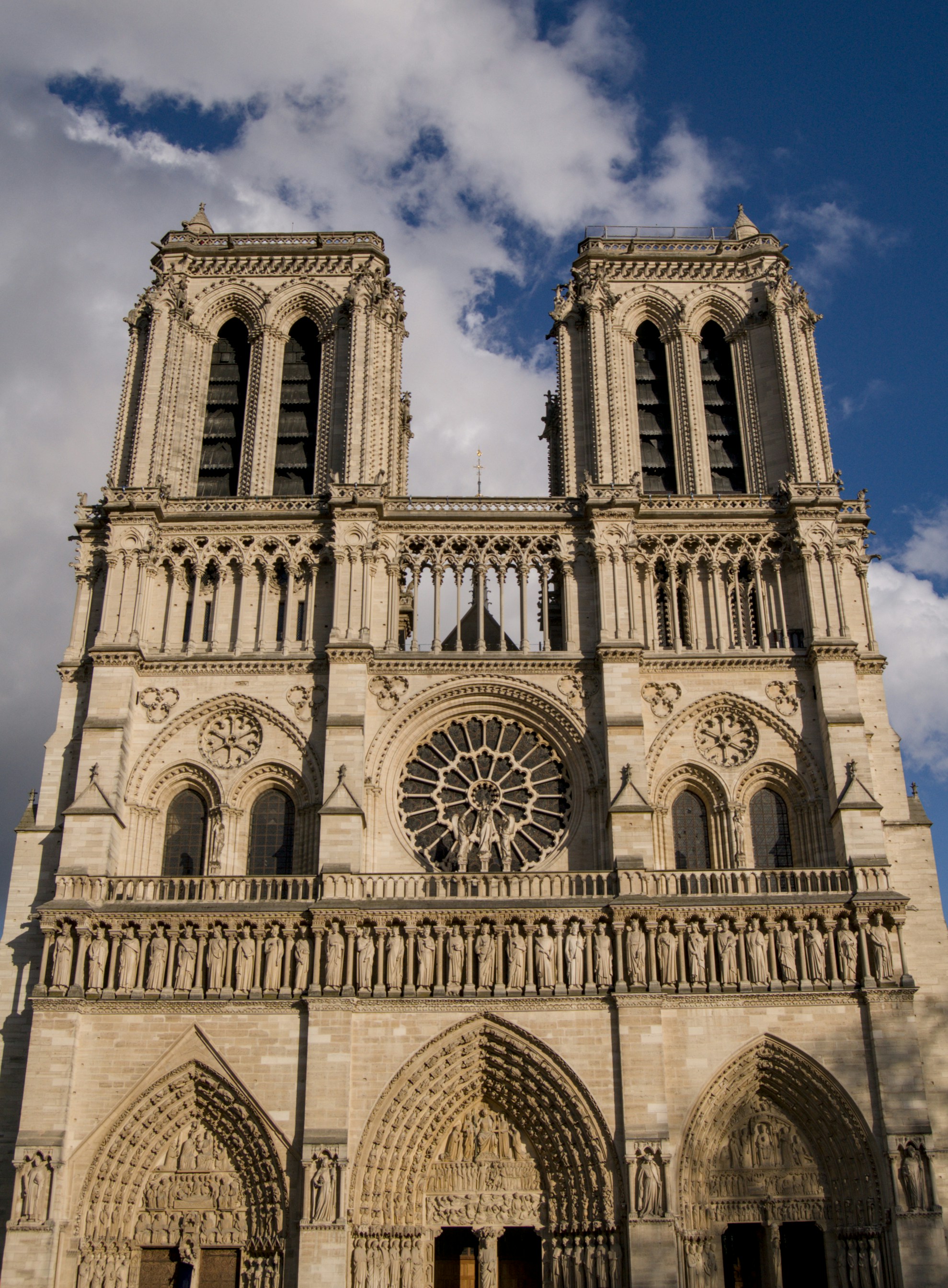 Notre-Dame Cathedral Facade: Sunlit Detail and Rose Window