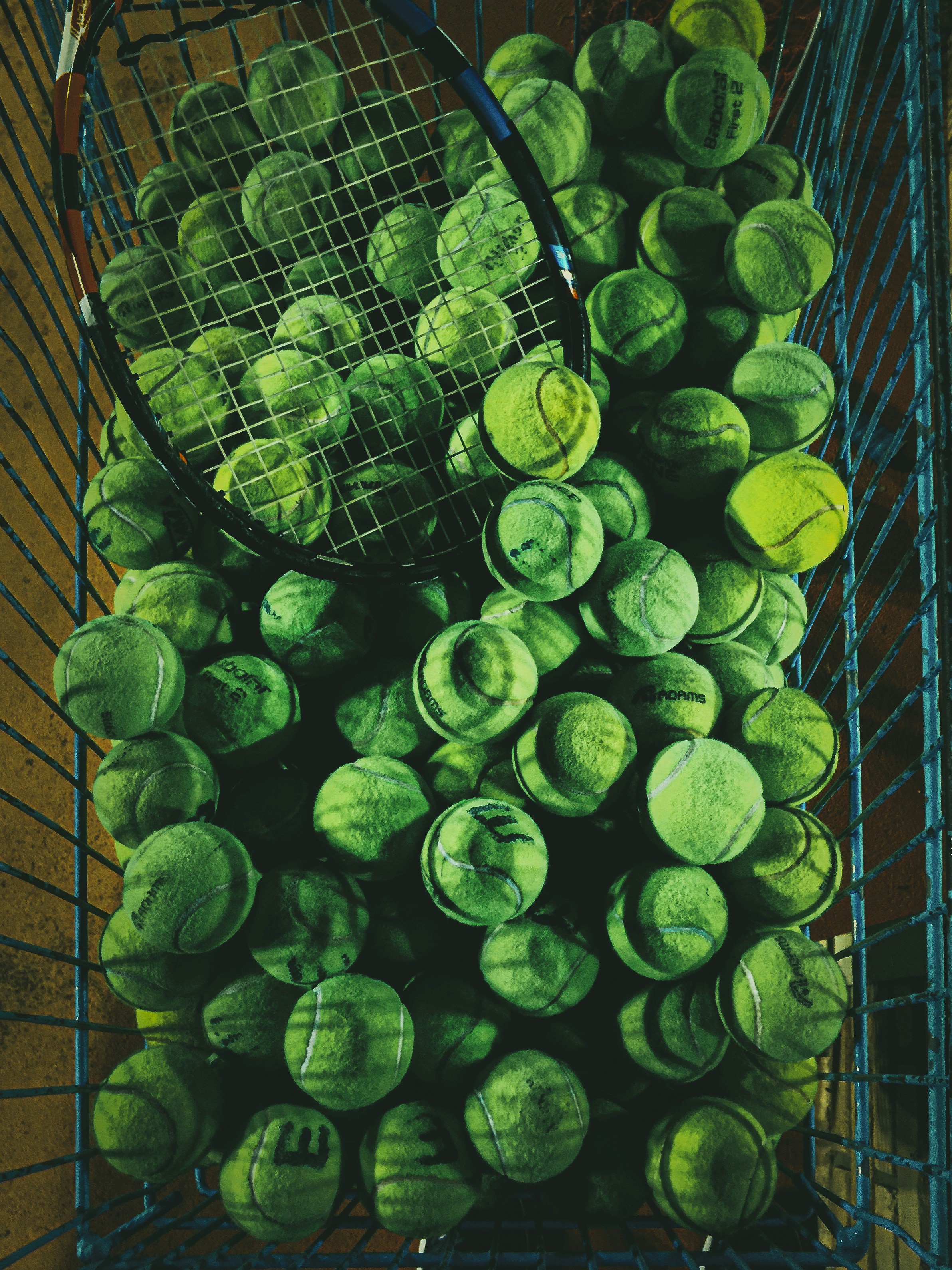 Tennis Ball Green A minimalist close-up of a bright, textured neon-green tennis ball on a clean surface, emphasizing its fuzzy felt exterior and classic yellow-green color, isolated for a striking, bold, and sporty visual composition. Processed with VSCO with ke1 preset