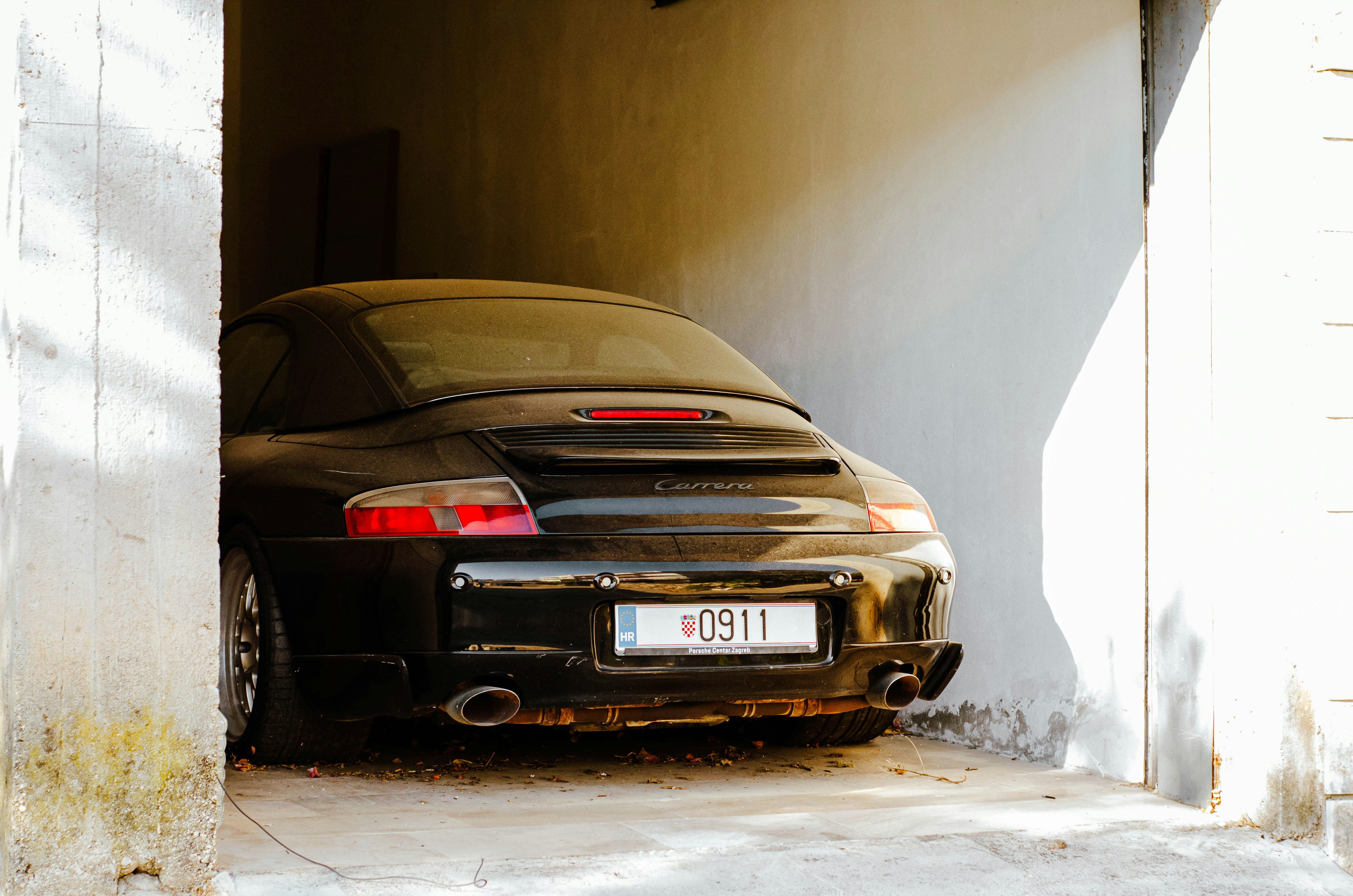 Shadowed Porsche Resting in a Quiet Garage
