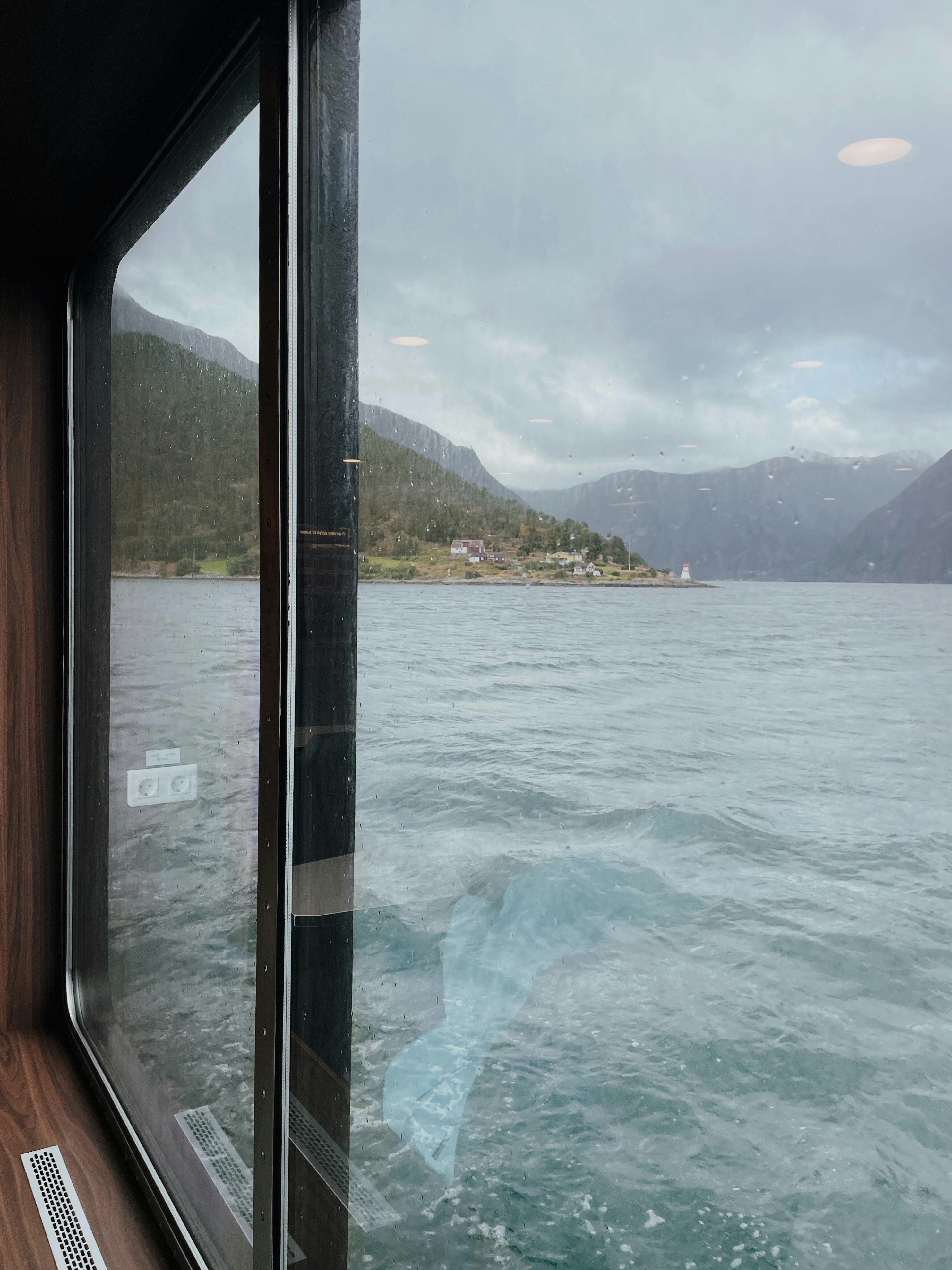 Through the Window: Fjord and Mountains in Quiet Motion
