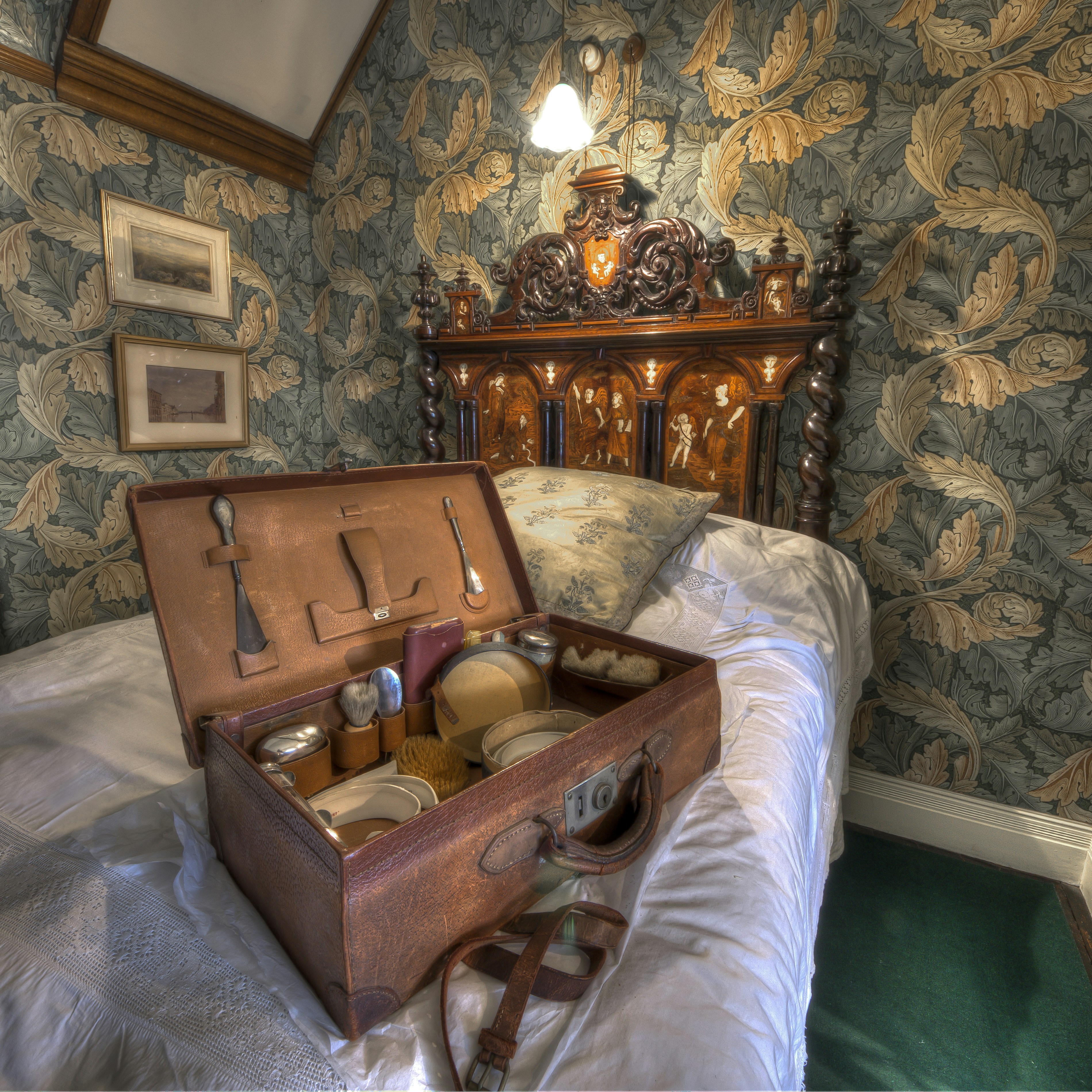 A Vintage Grooming Kit Resting on an Ornate Bedside Trunk