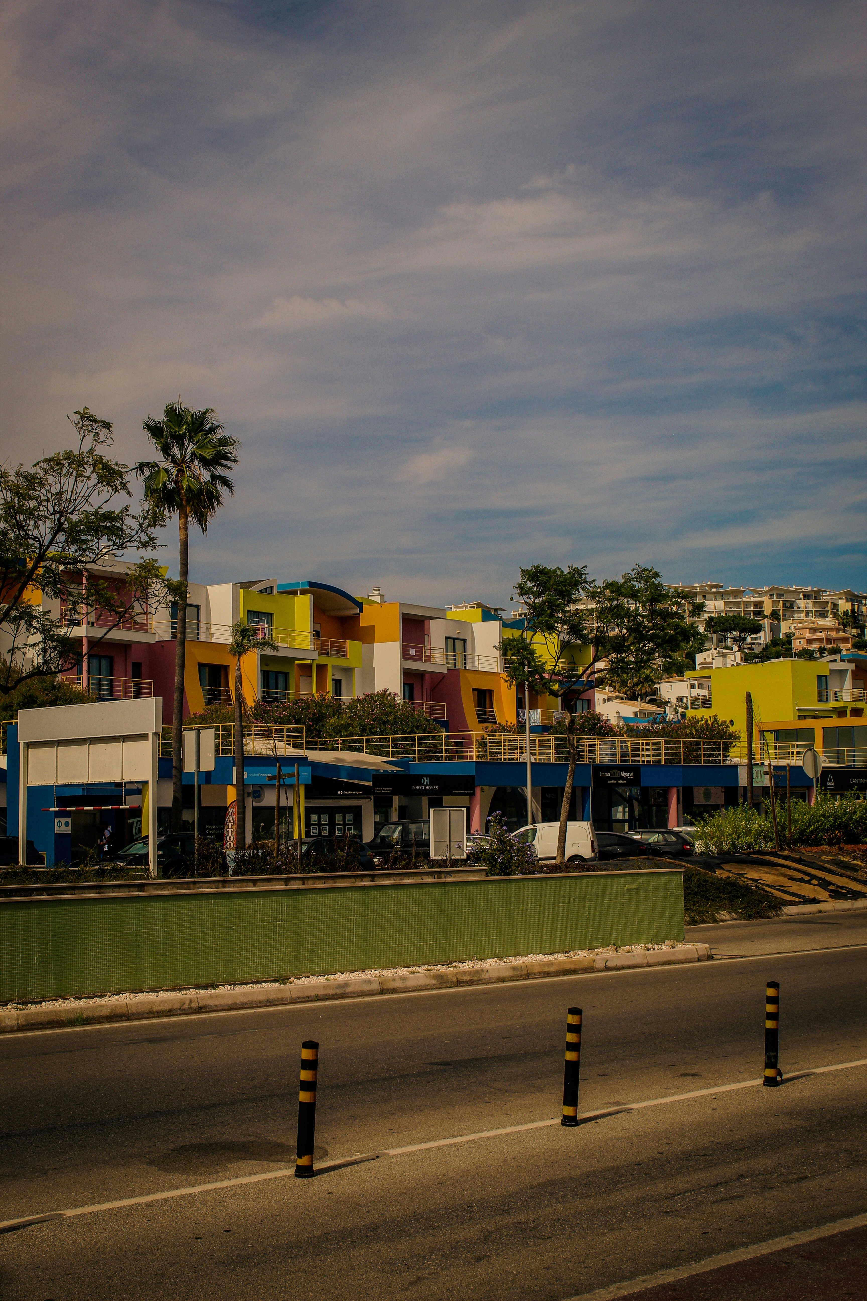 Colorful Coastal Row: A Quiet Street in Bright Apartment Blocks