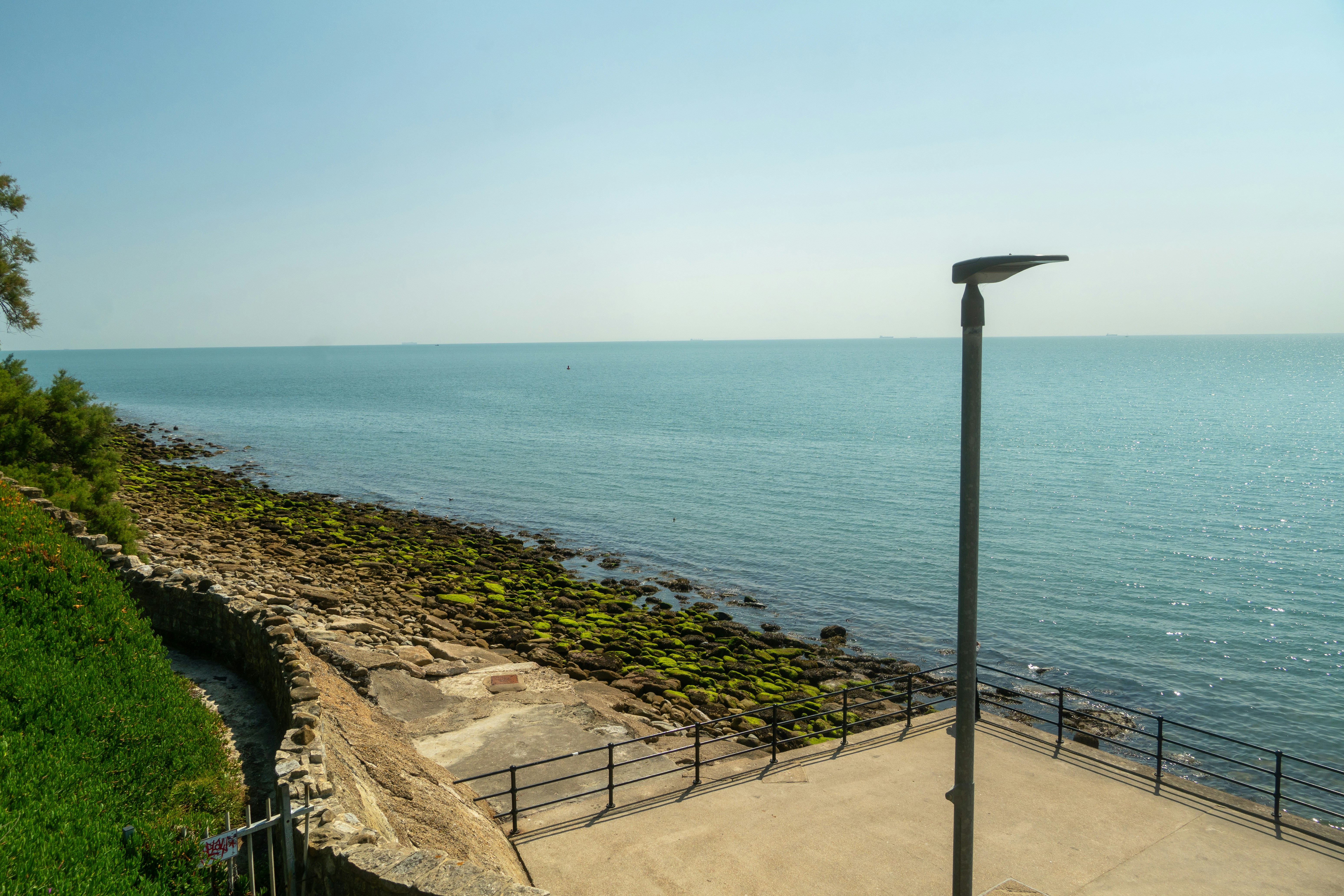 Sunlit Promenade by the Quiet Sea