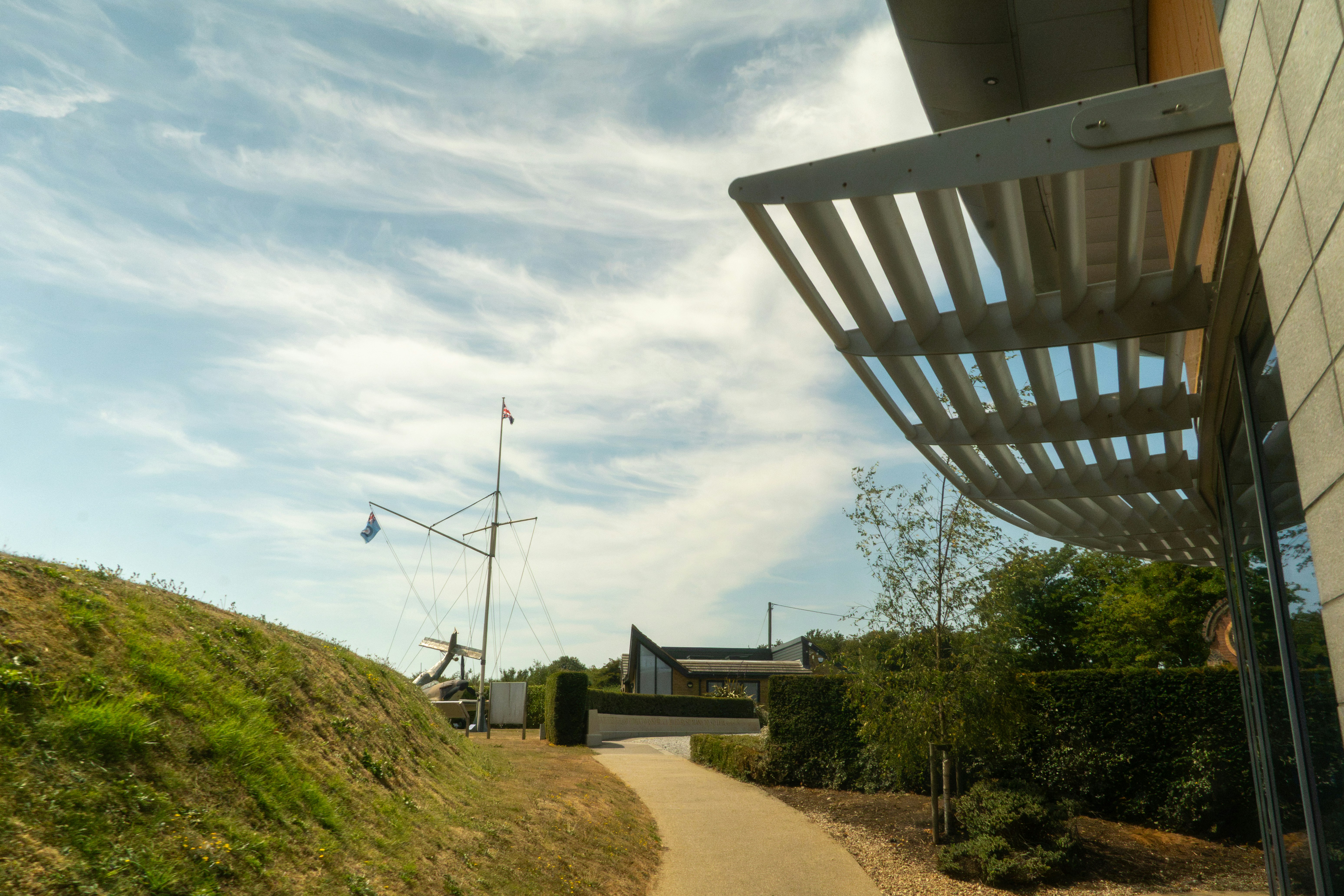 Path toward the Harbour: A Quiet Corridor Between Modern Shelter and Wild Slope