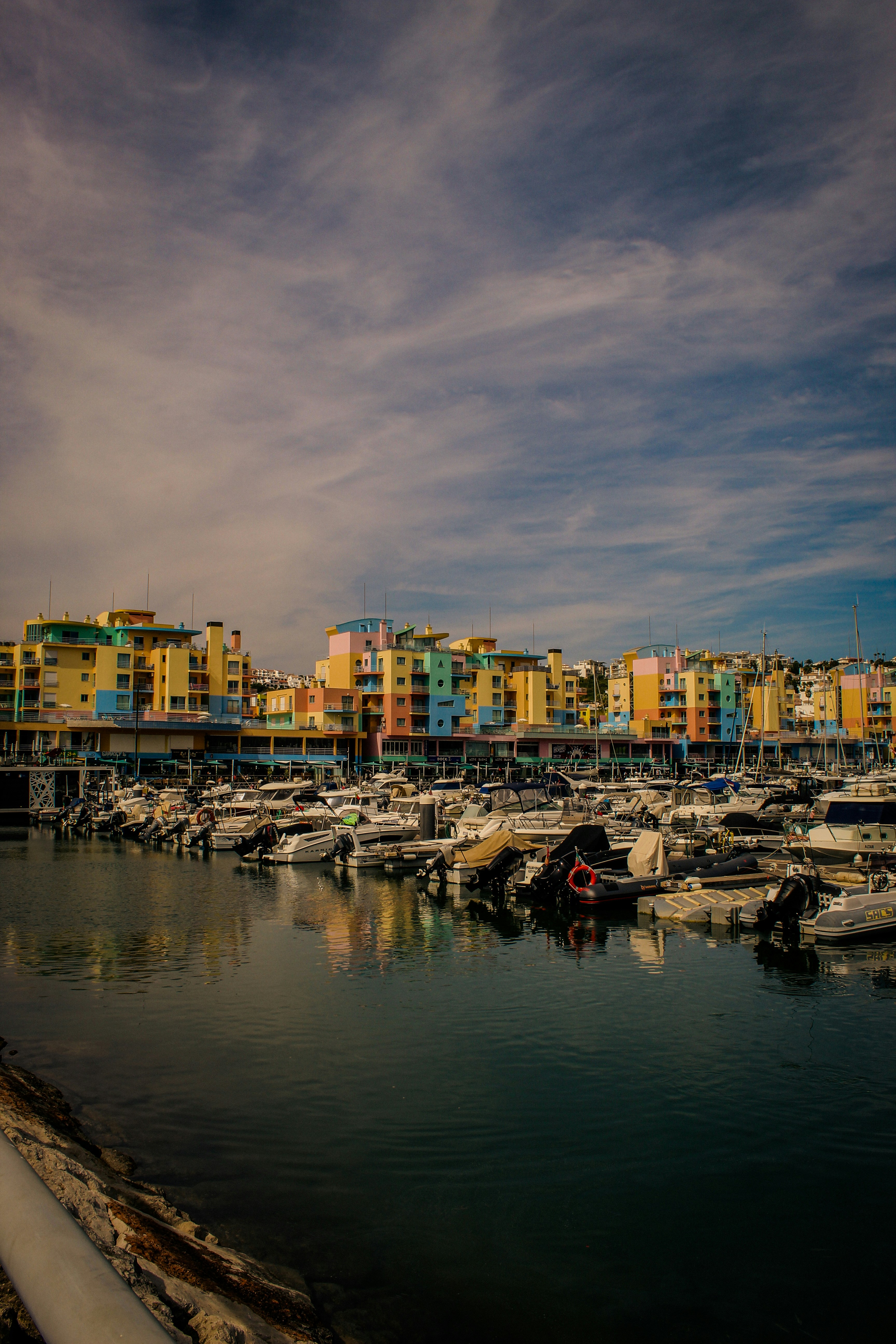 Harbor Mosaic: Colorful Apartments Guard a Quiet Marina