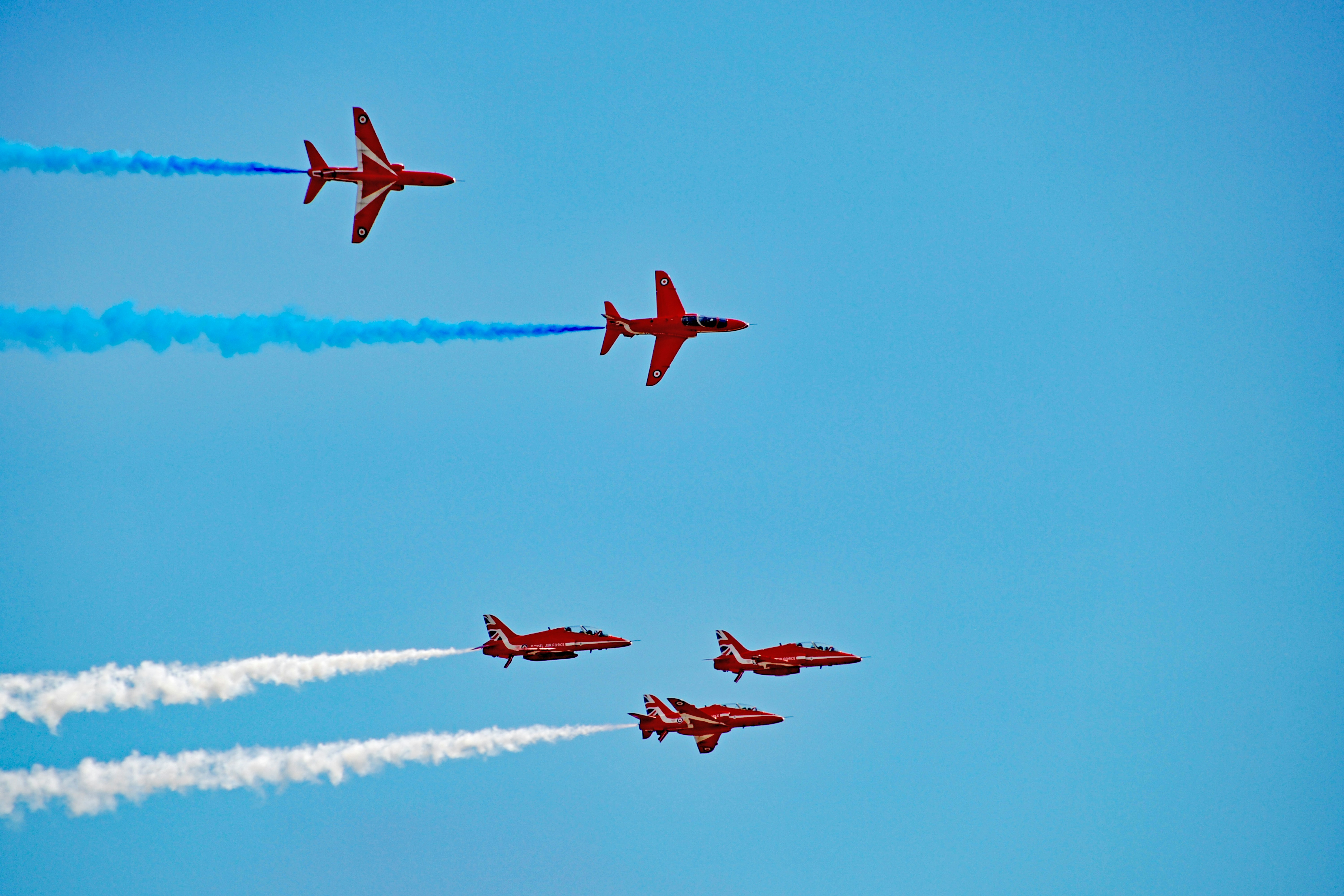 Red Jets in a Sky-Thread of White Trails