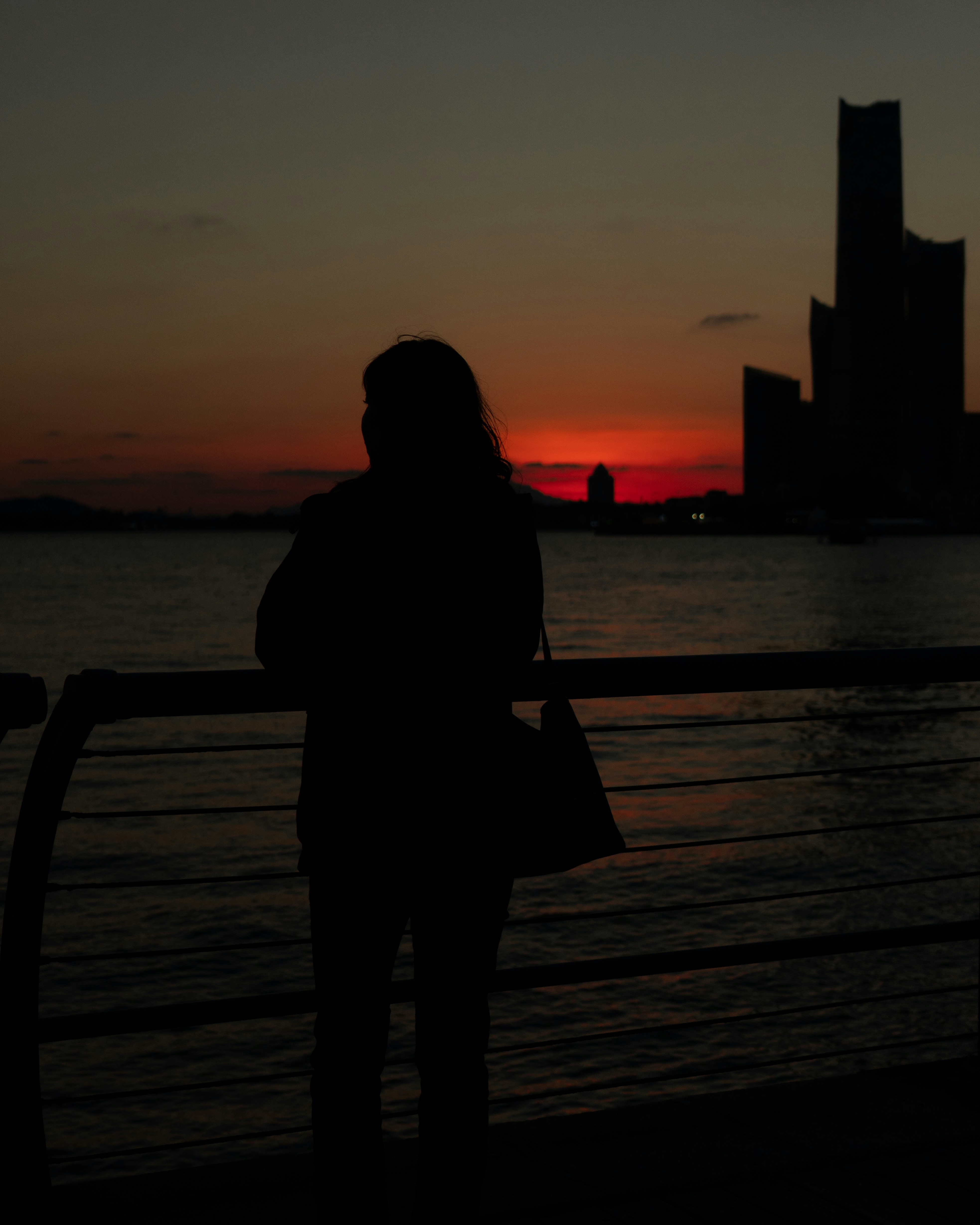 Silhouette at Sunset by the Riverfront