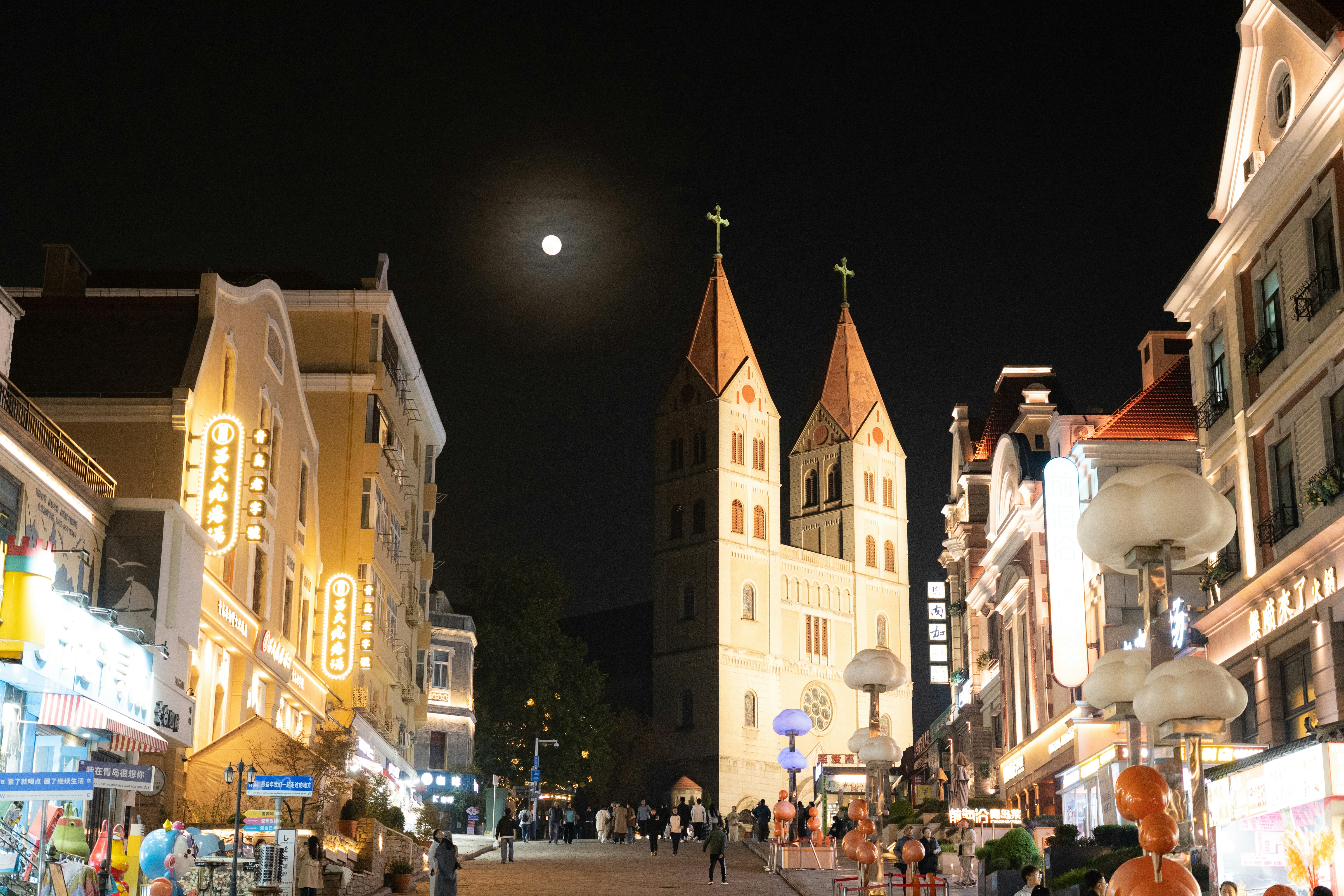 Moonlit Piazza: Twin Towers Guard the Night Market