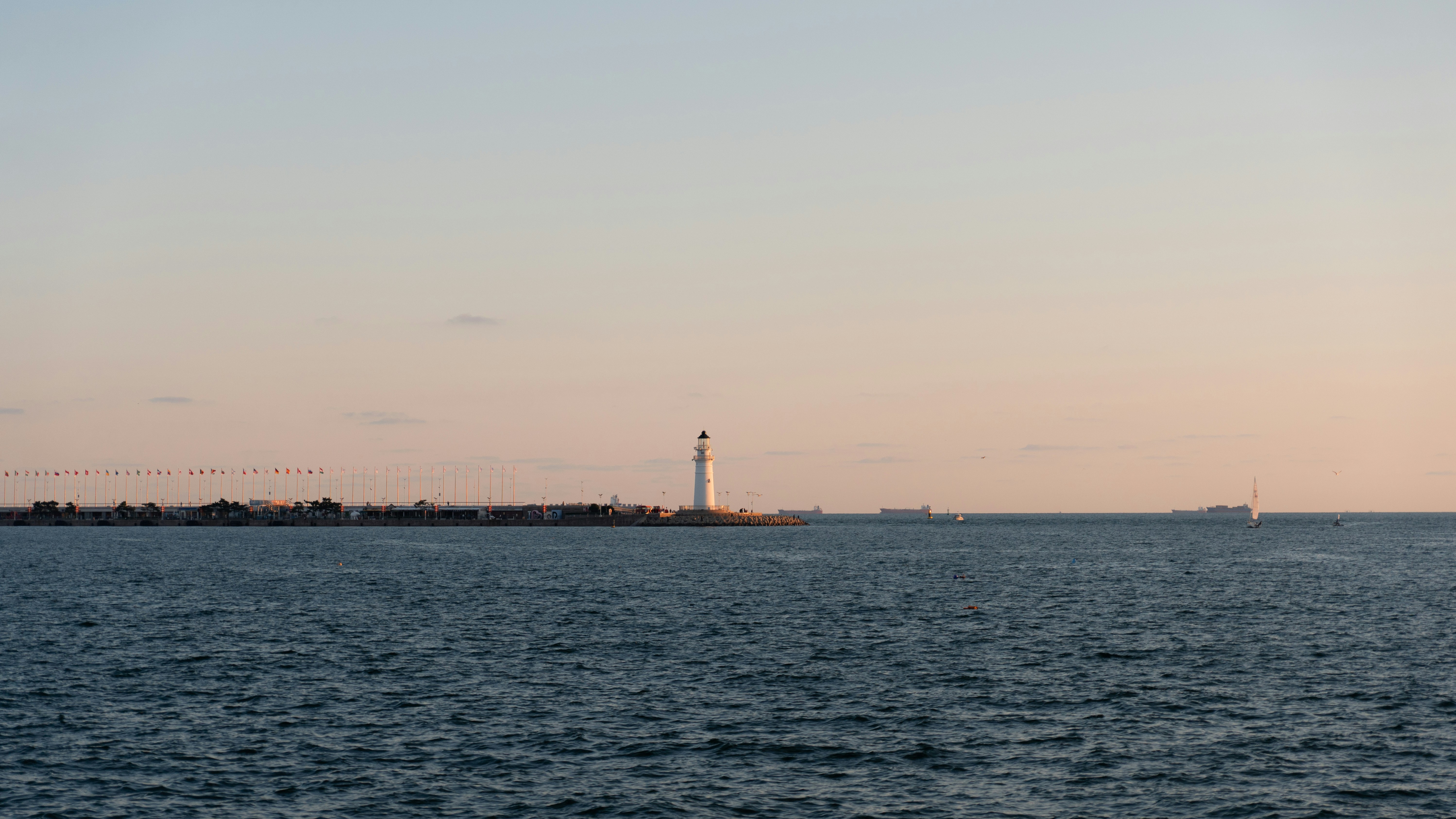 Lighthouse at Dusk: A Quiet Beacon Over Calm Waters