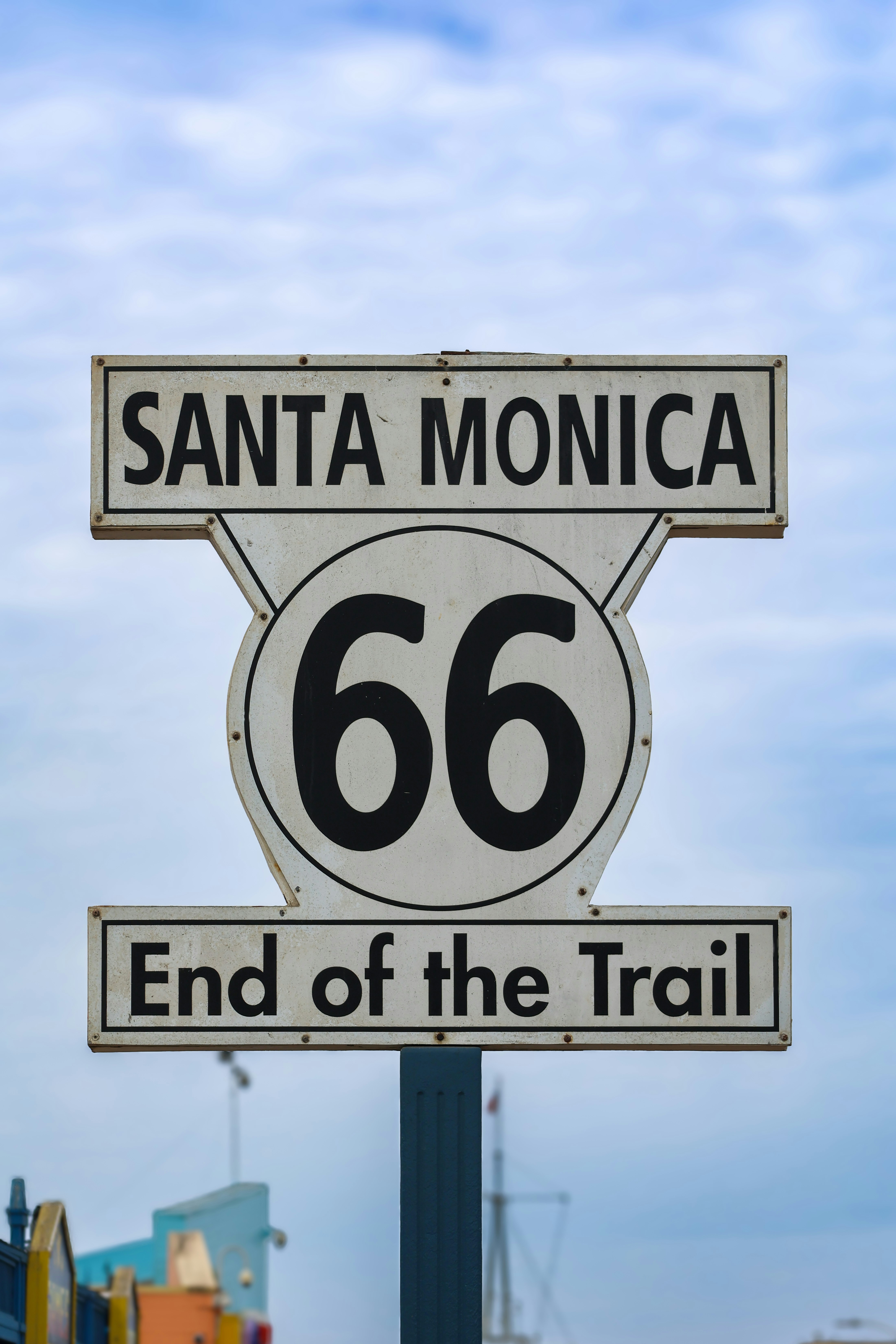 End of the Trail: A Route 66 Sign Stands Against a Clear Blue Sky