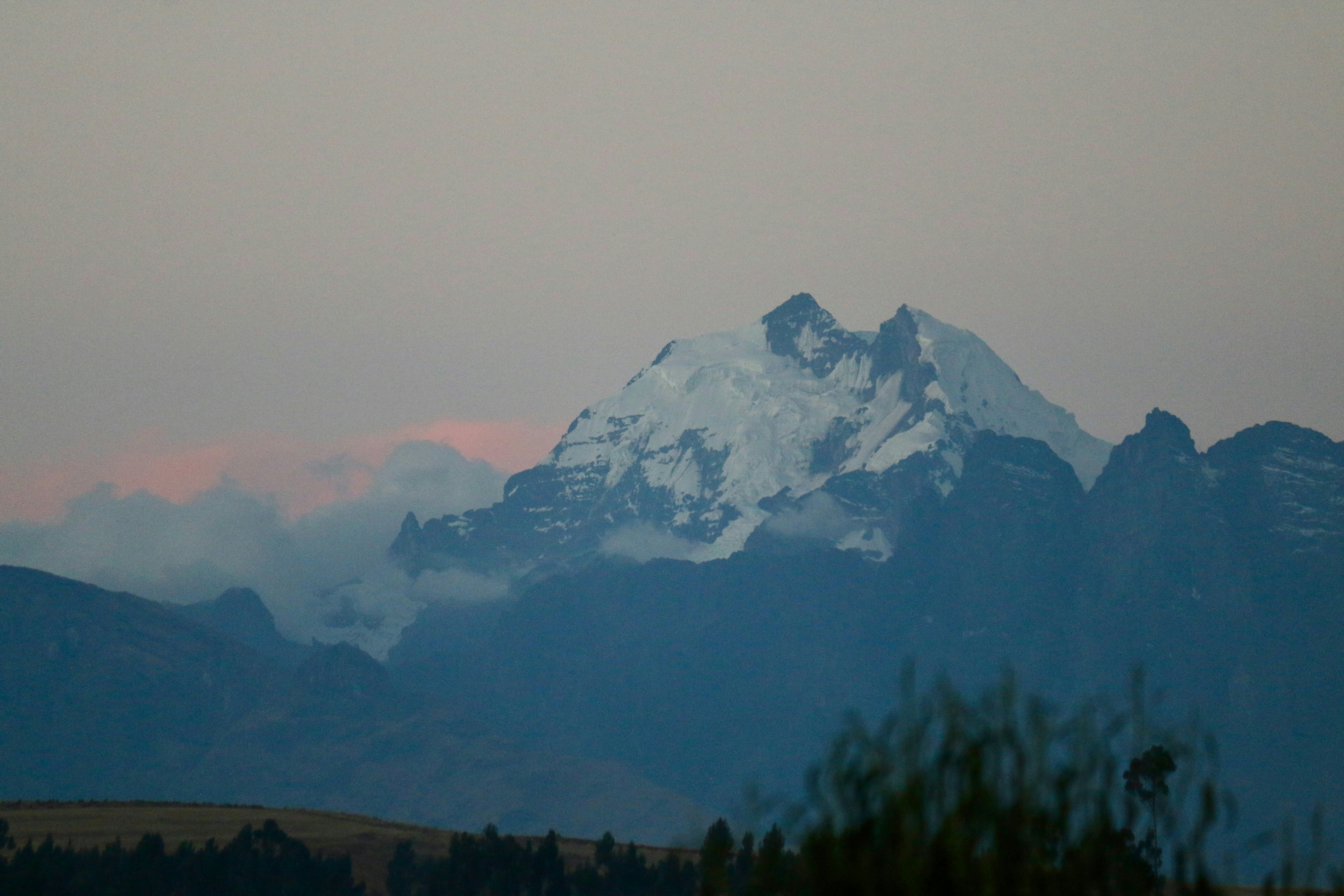 Snow-capped Peak Emerges From Smoky Dusk