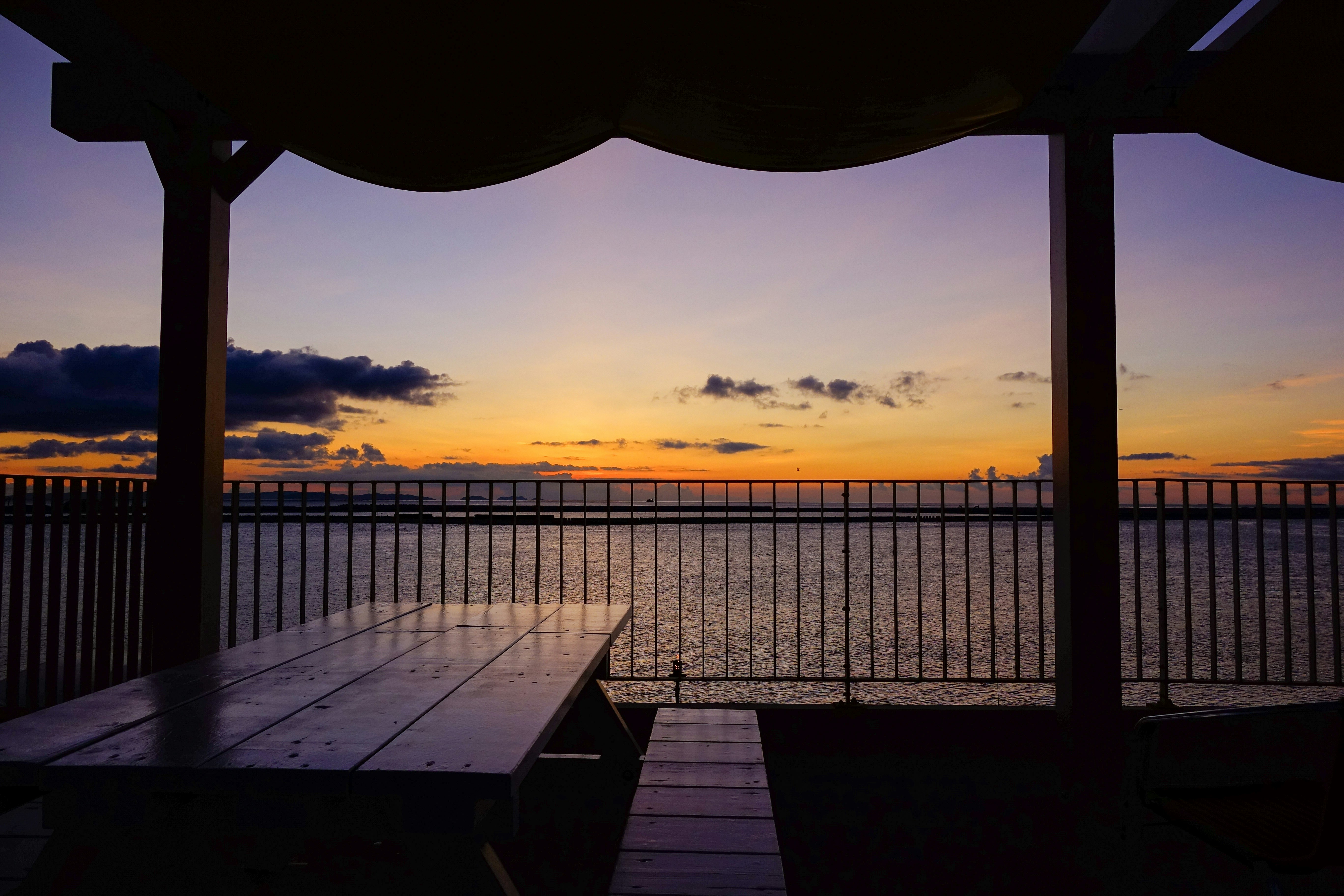 Sunset Over the Quiet Pier: silhouettes and fading light