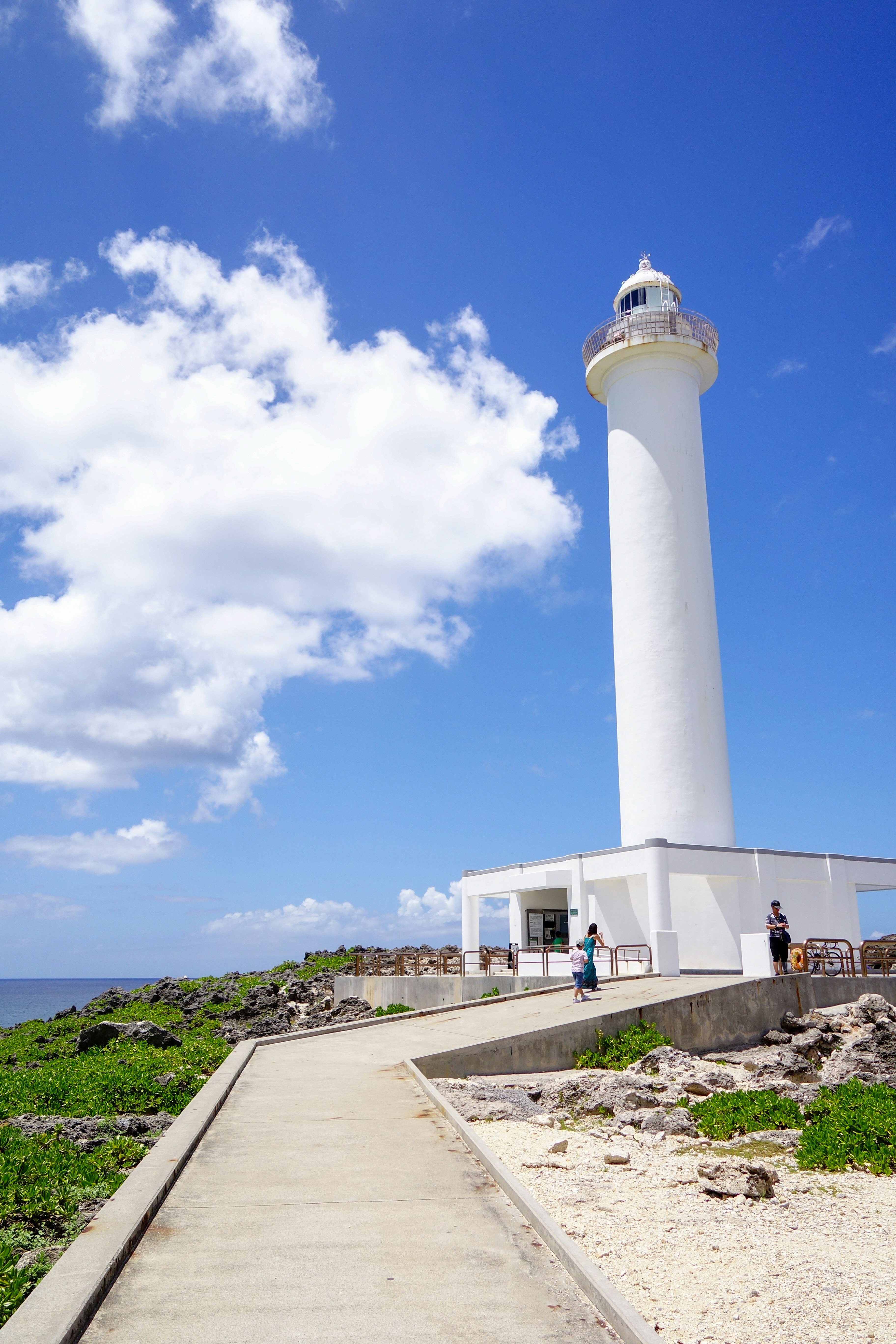 Guiding Light: A White Lighthouse Reaches for the Sky