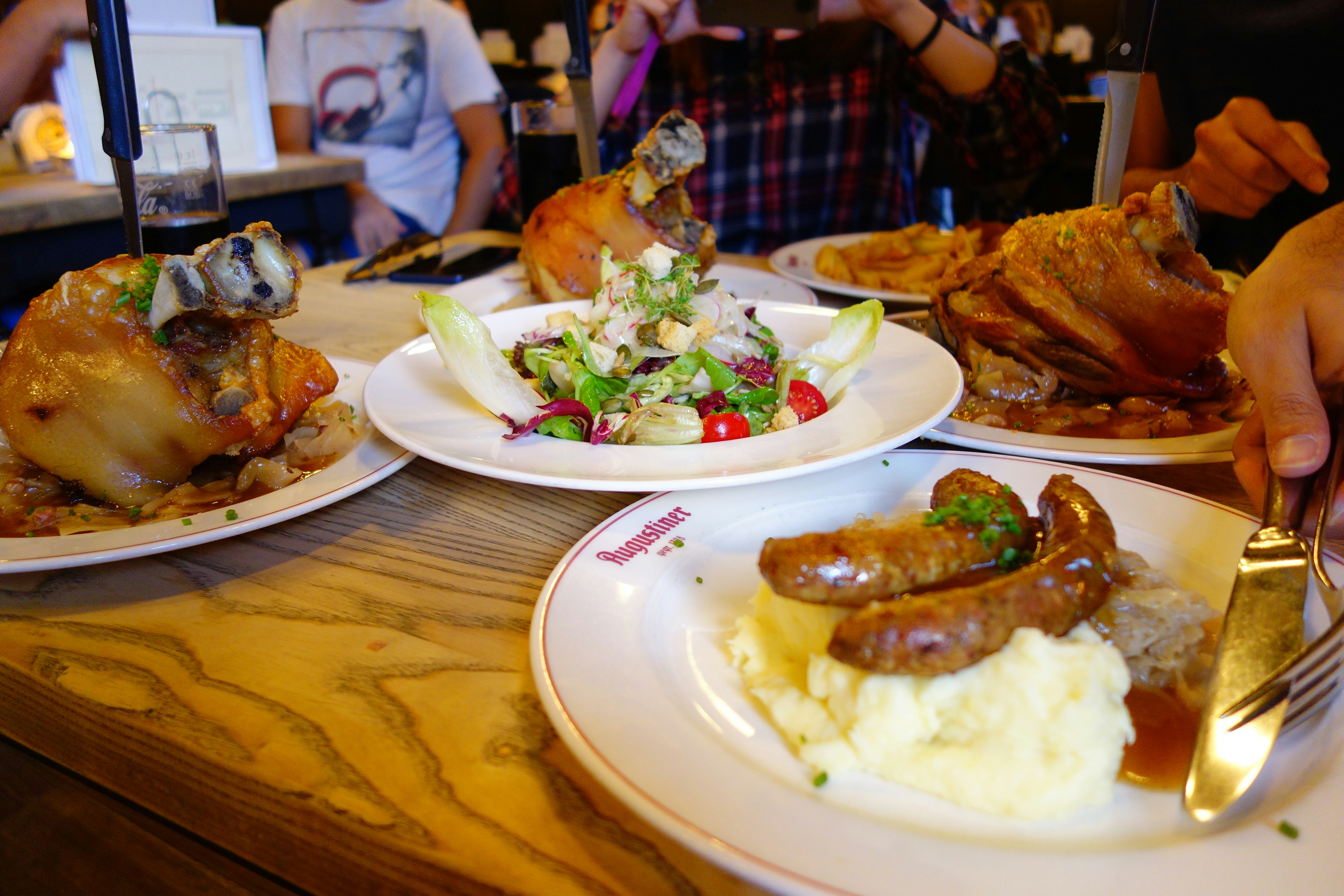 Echos of feast: roasted poultry and plates of mashed potatoes dominate a lively table