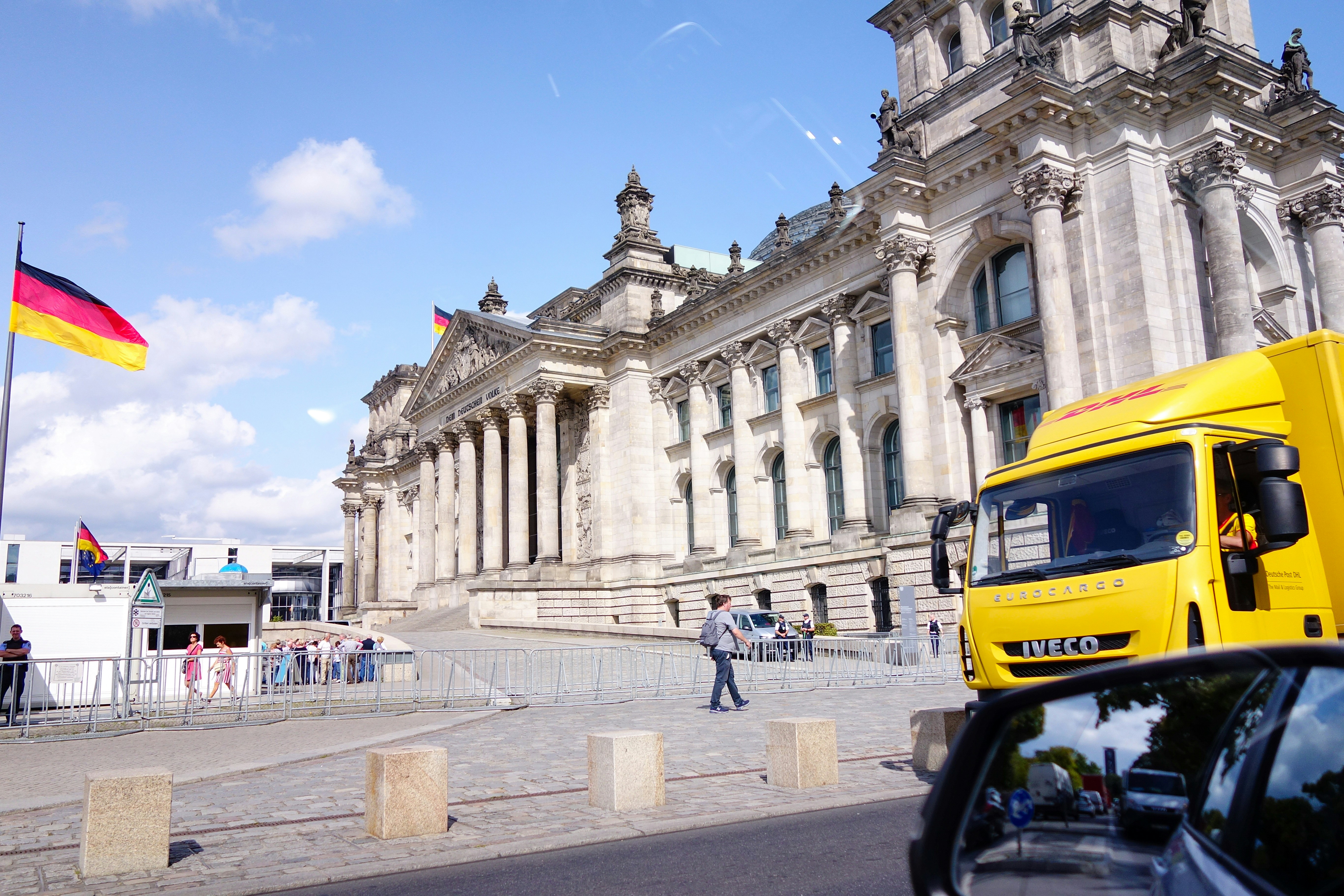 Golden Truck at a Neoclassical Courtyard