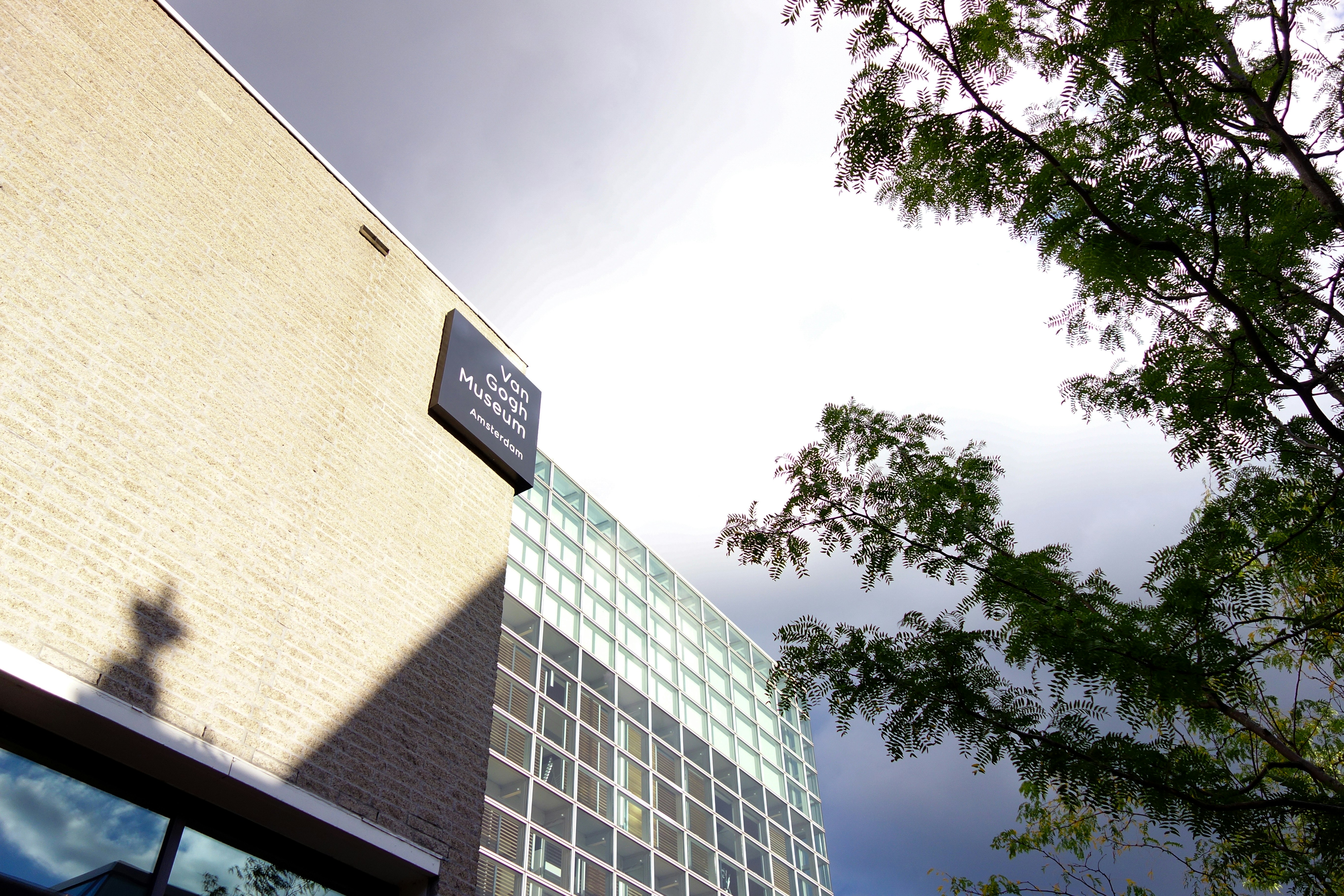 Shadowed Wall, Glass Facade, and Sky: Urban Geometry in Afternoon Light