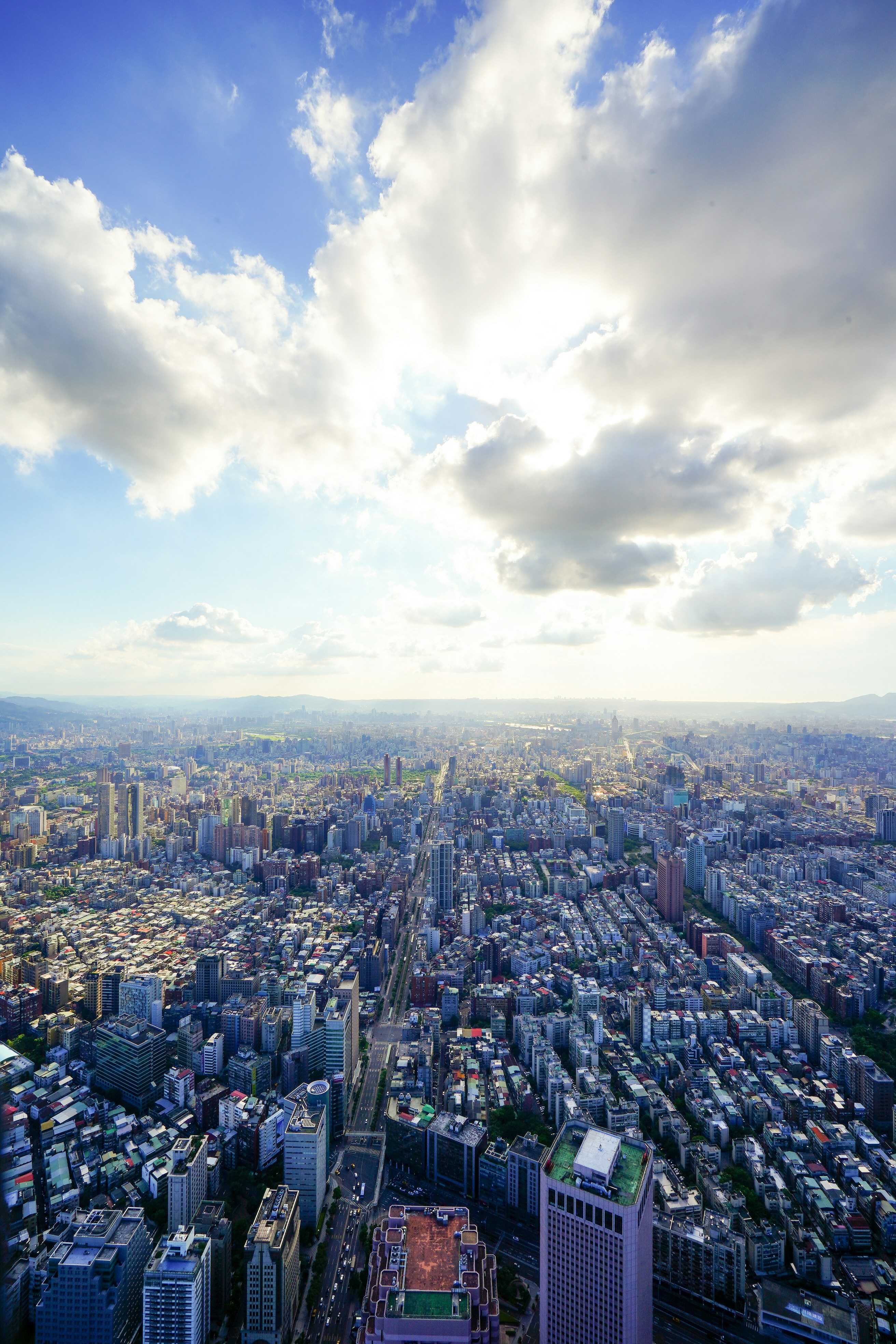 Aerial Pulse: City Grid Beneath the Luminous Sky