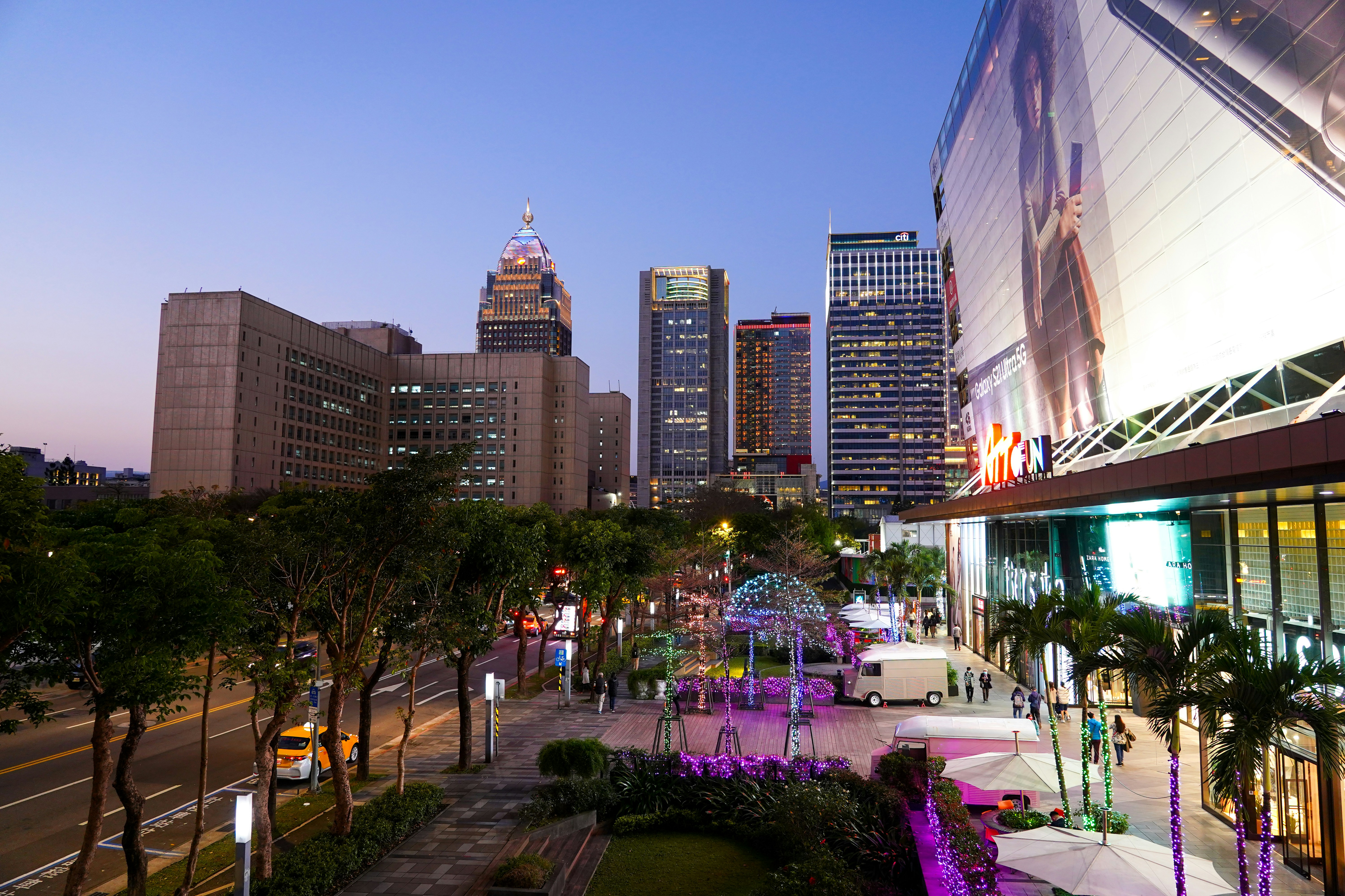 City Skyline at Dusk: Neon Bloom near the Atrium