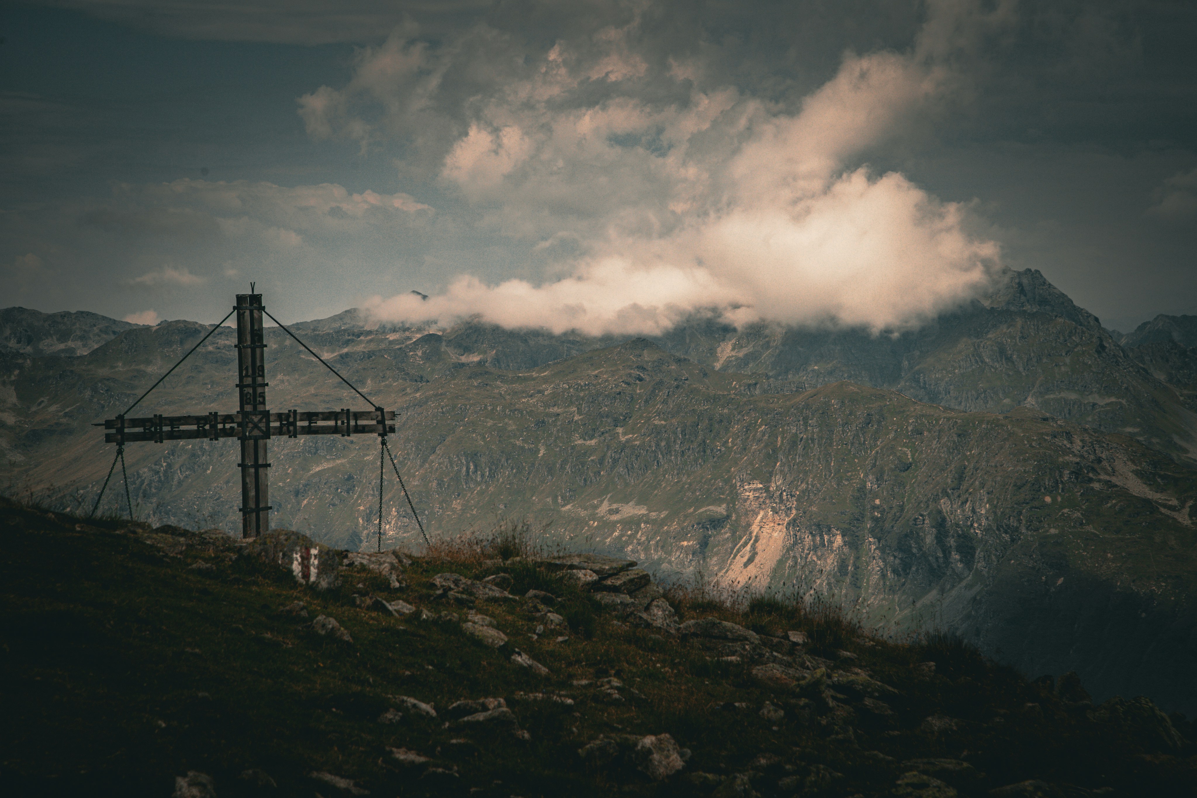 Cross on the Ridge: A Silent Sentinel Above the Valleys