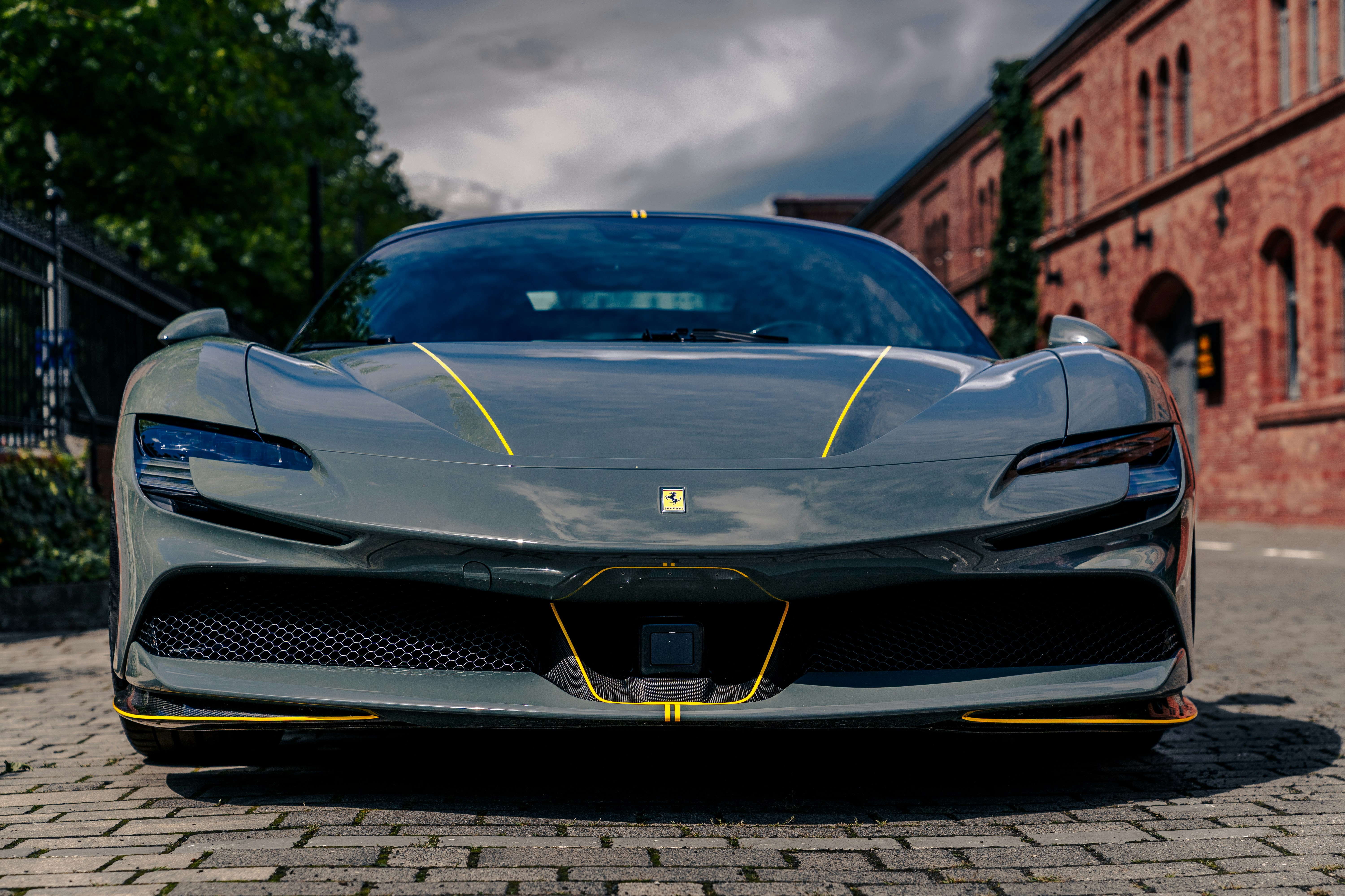Front-Quarter Glint: A Ferrari’s Precision on Cobbled Street