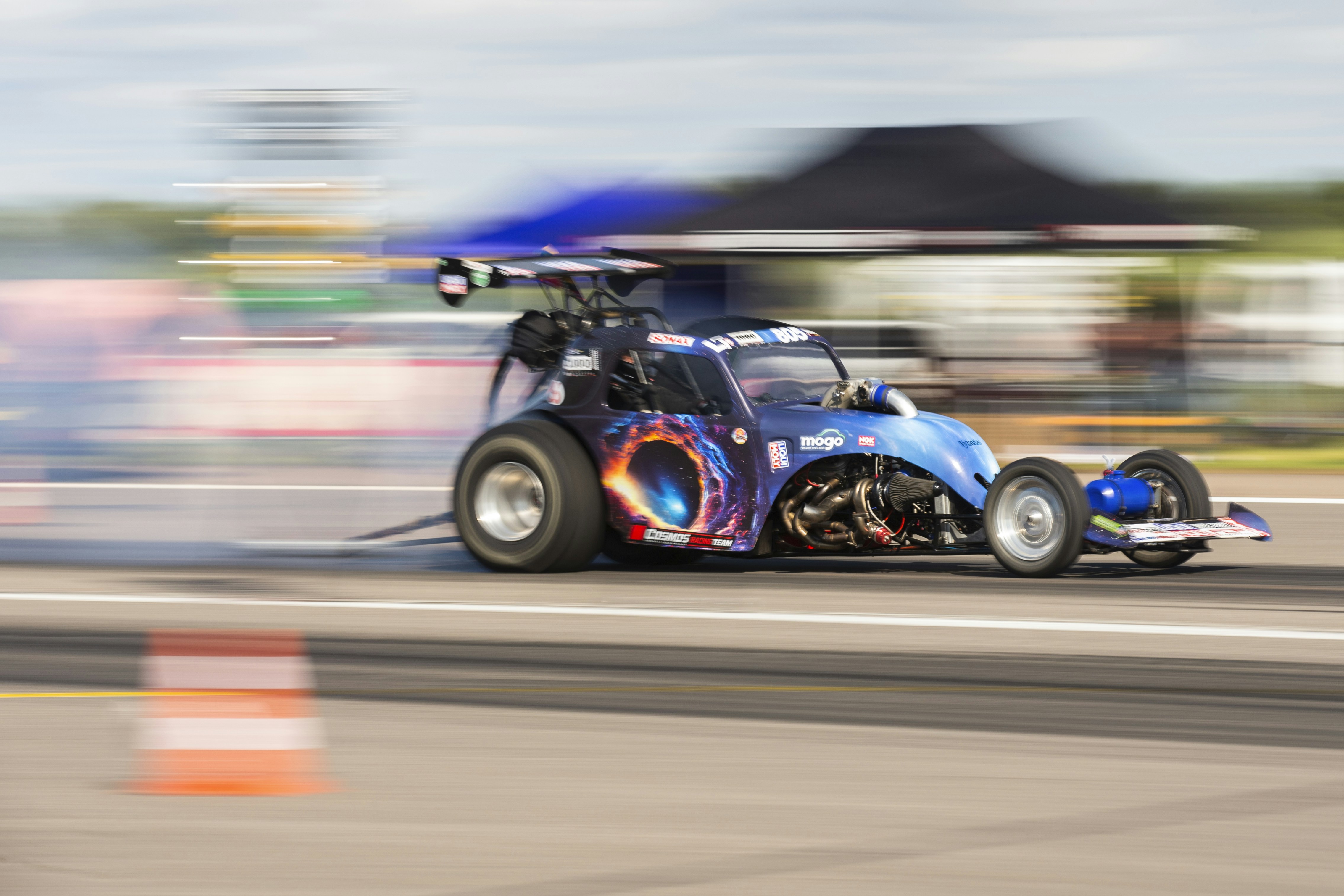 Blazing Dragster in a Blur of Velocity