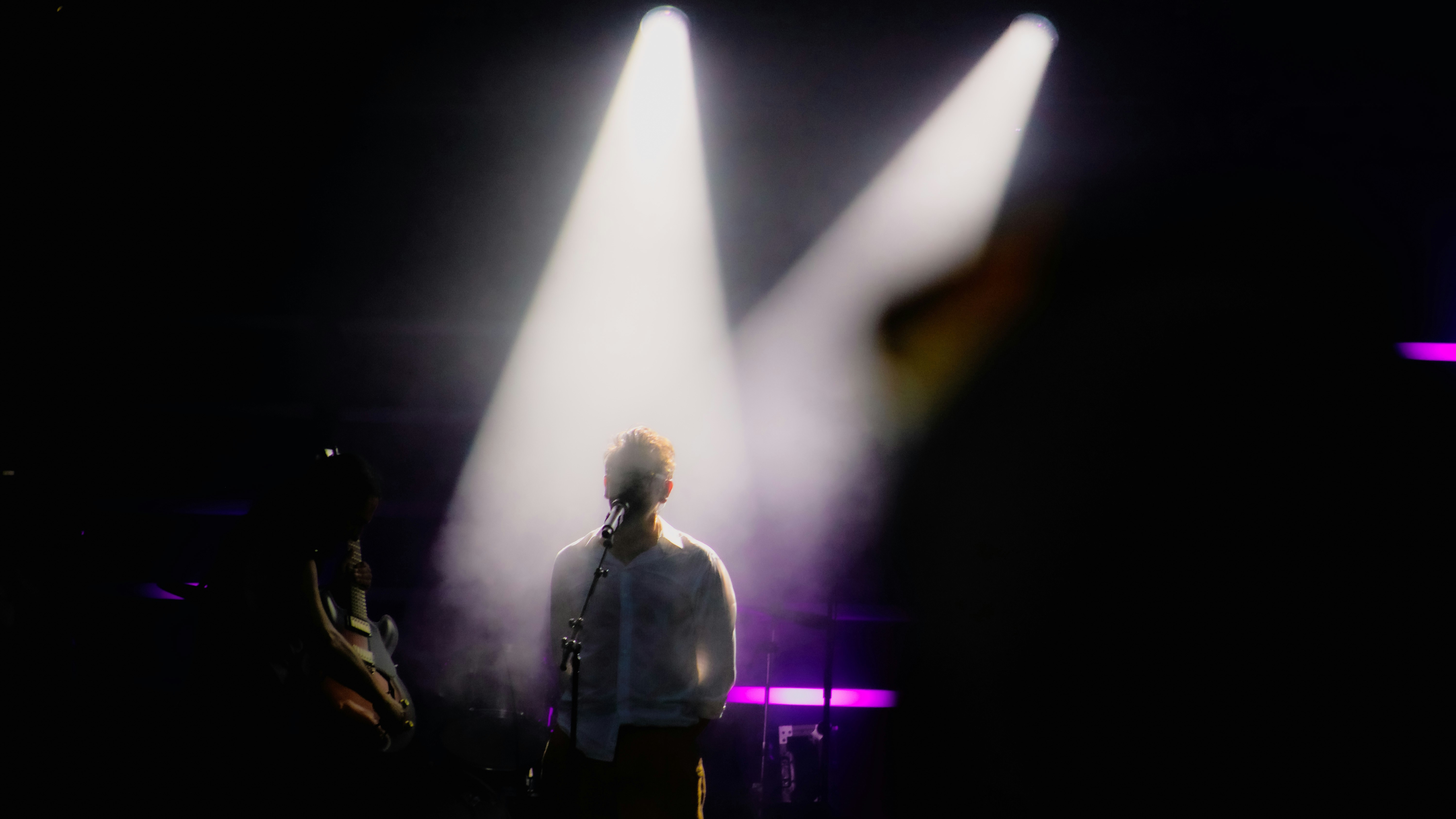 Spotlight Silhouette: A Vocalist in the Gloom