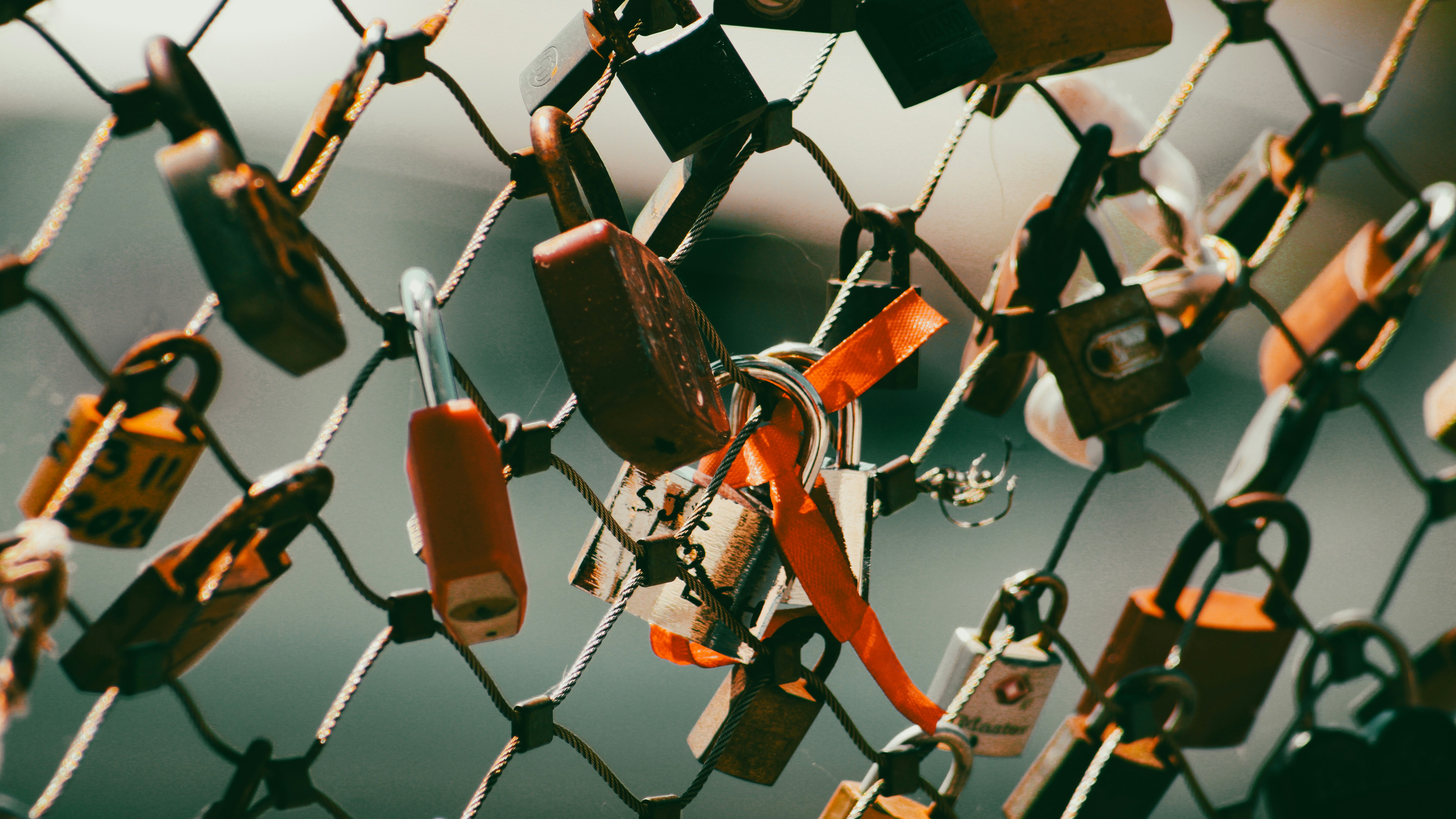 Padlock Mosaic: A Close-Up of Hope Tied to Woven Chains