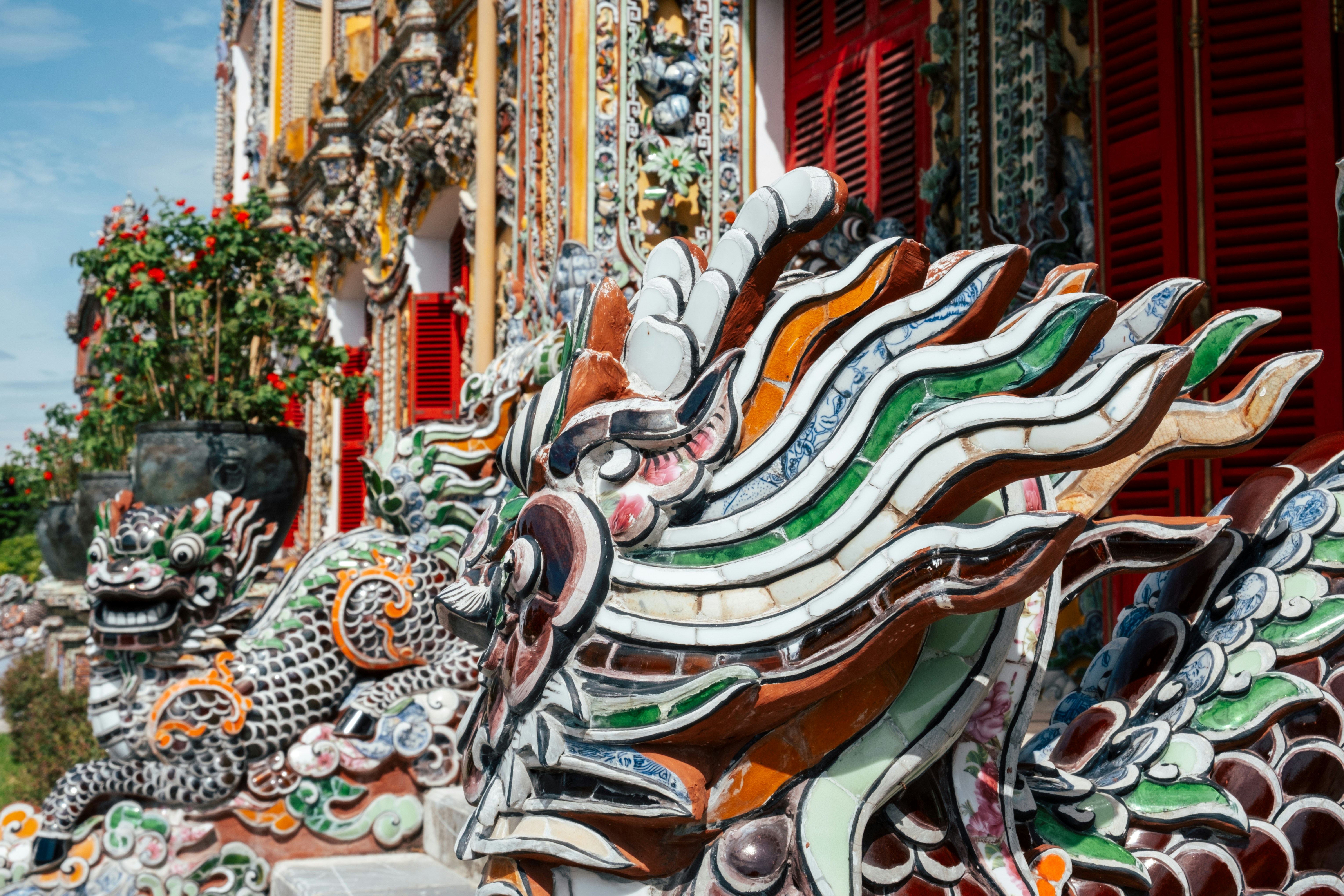 Dragons and Doors: Colorful Guardian Statues by the Temple Gate