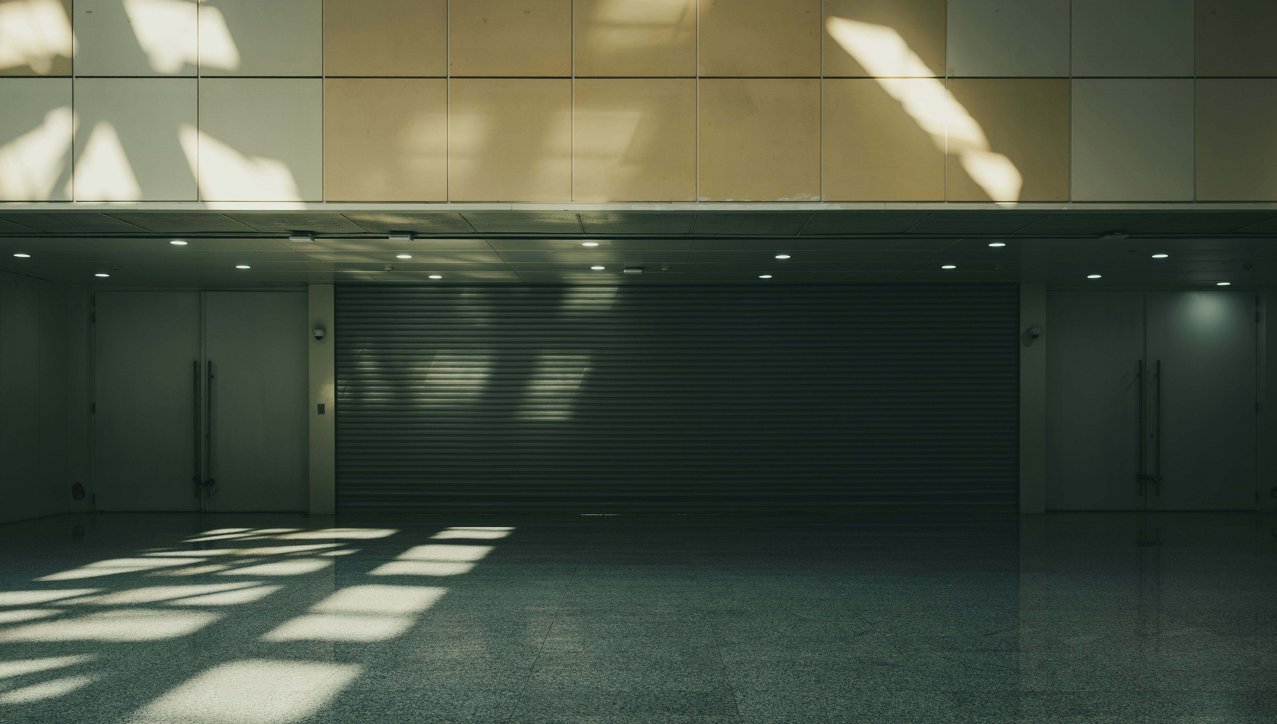 Silent Endeavor: The Shuttered Shopfront Under Monochrome Light