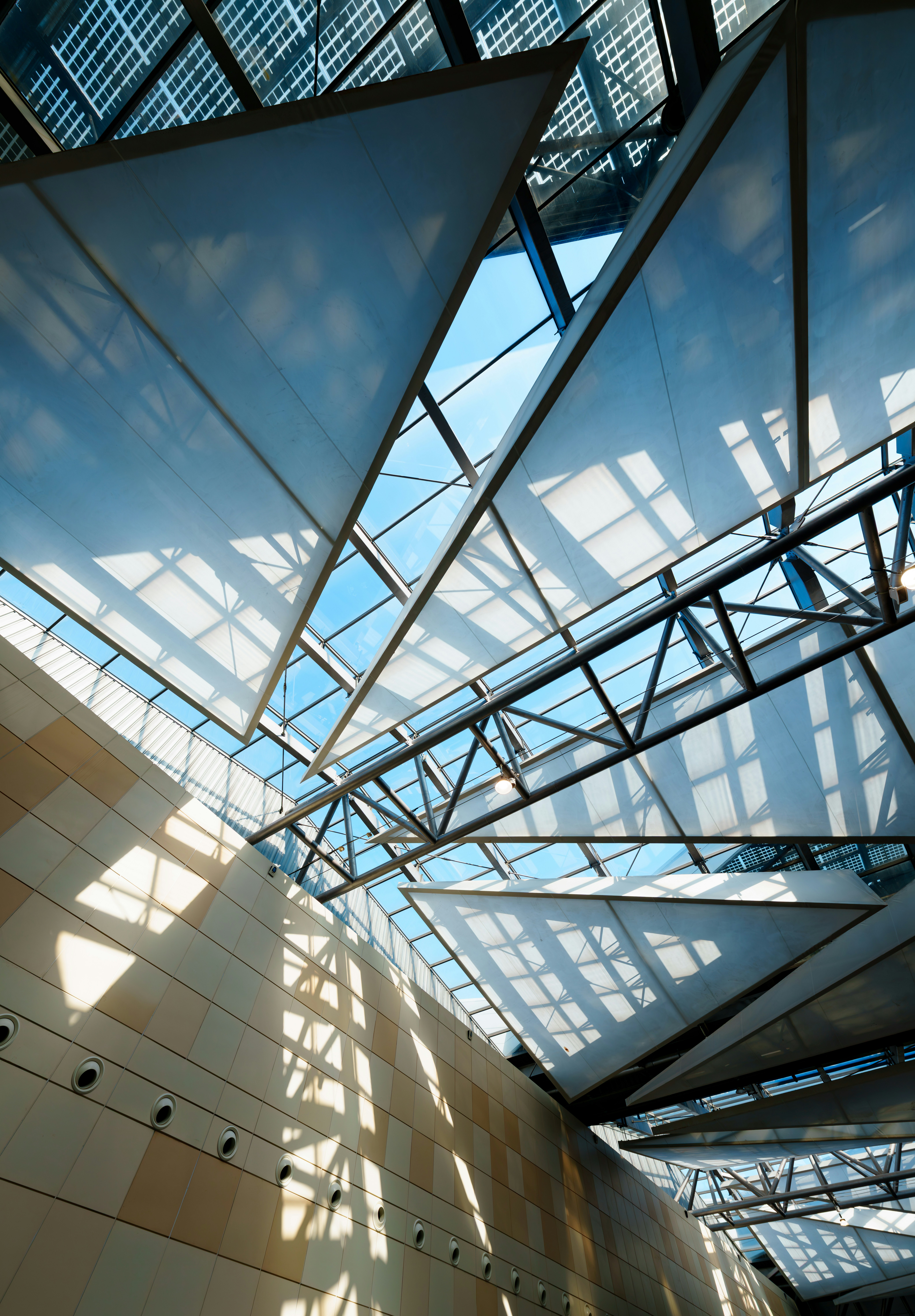 Geometric Canopy: Sunlit Glass Axis in Blue Hour Architecture