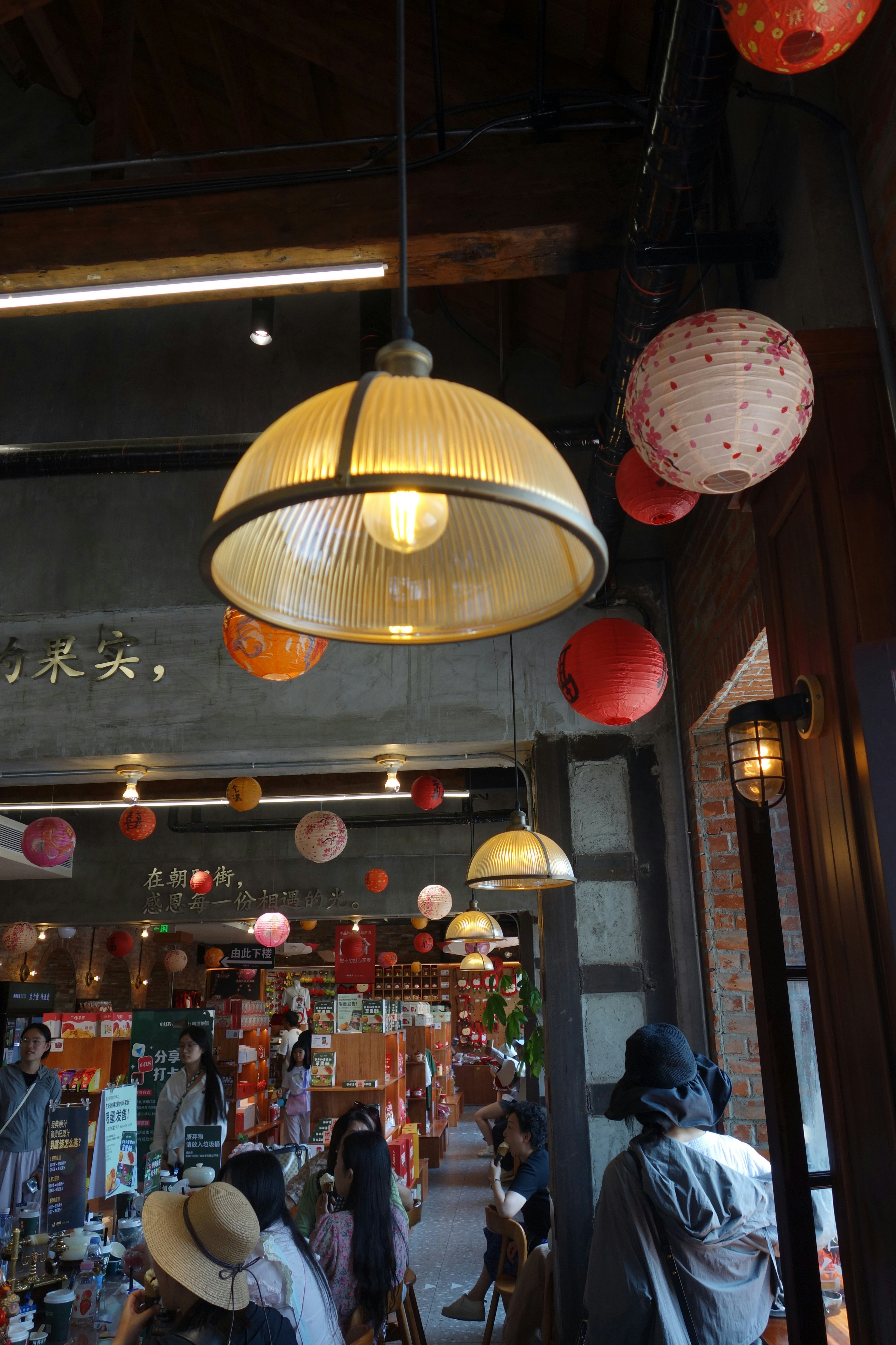 Lanterns and Tables: A Cozy Market Scene Inside a Lantern-lit Corridor