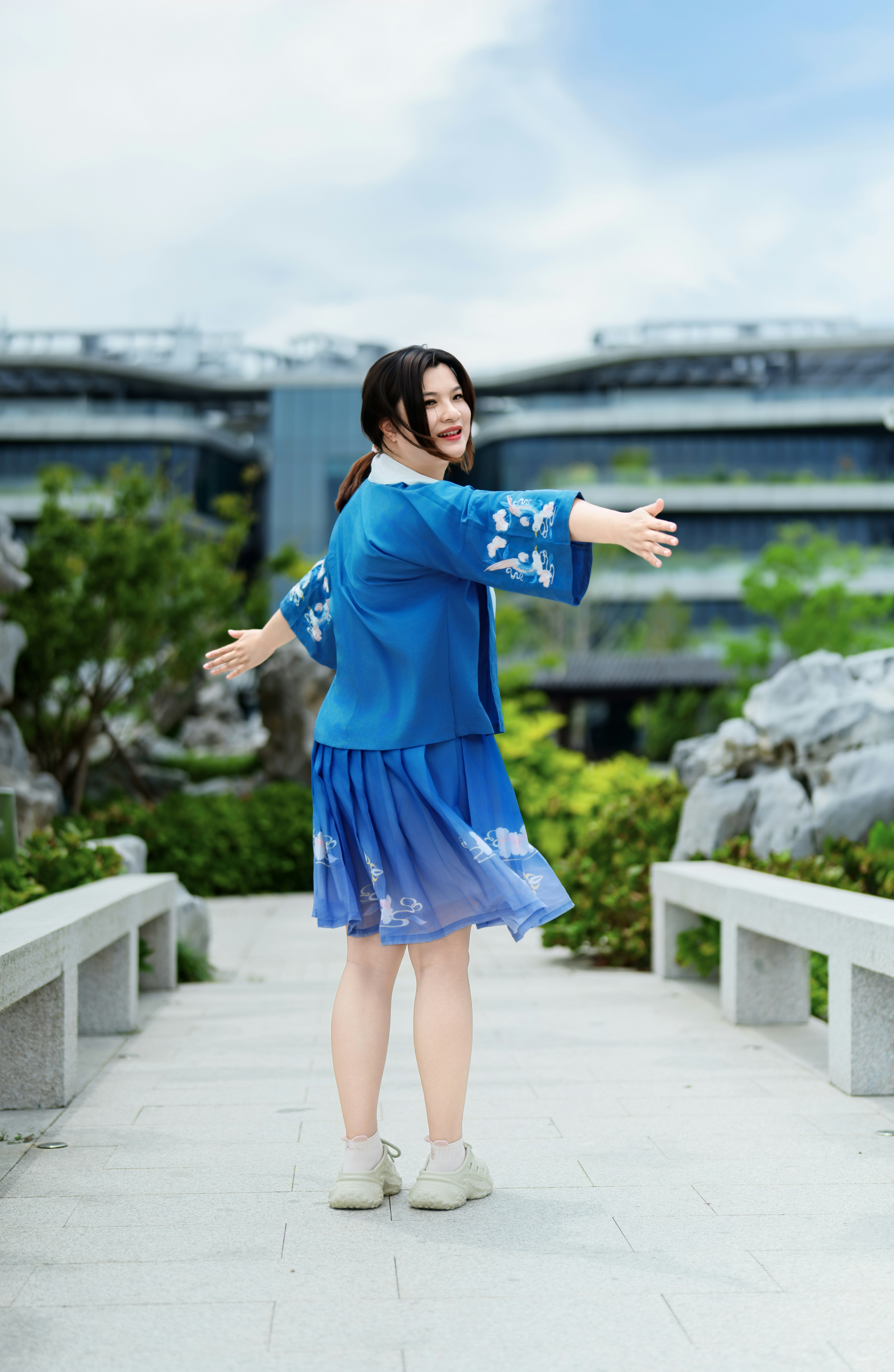 Blue-washed Grace: A Dancer in the Urban Garden