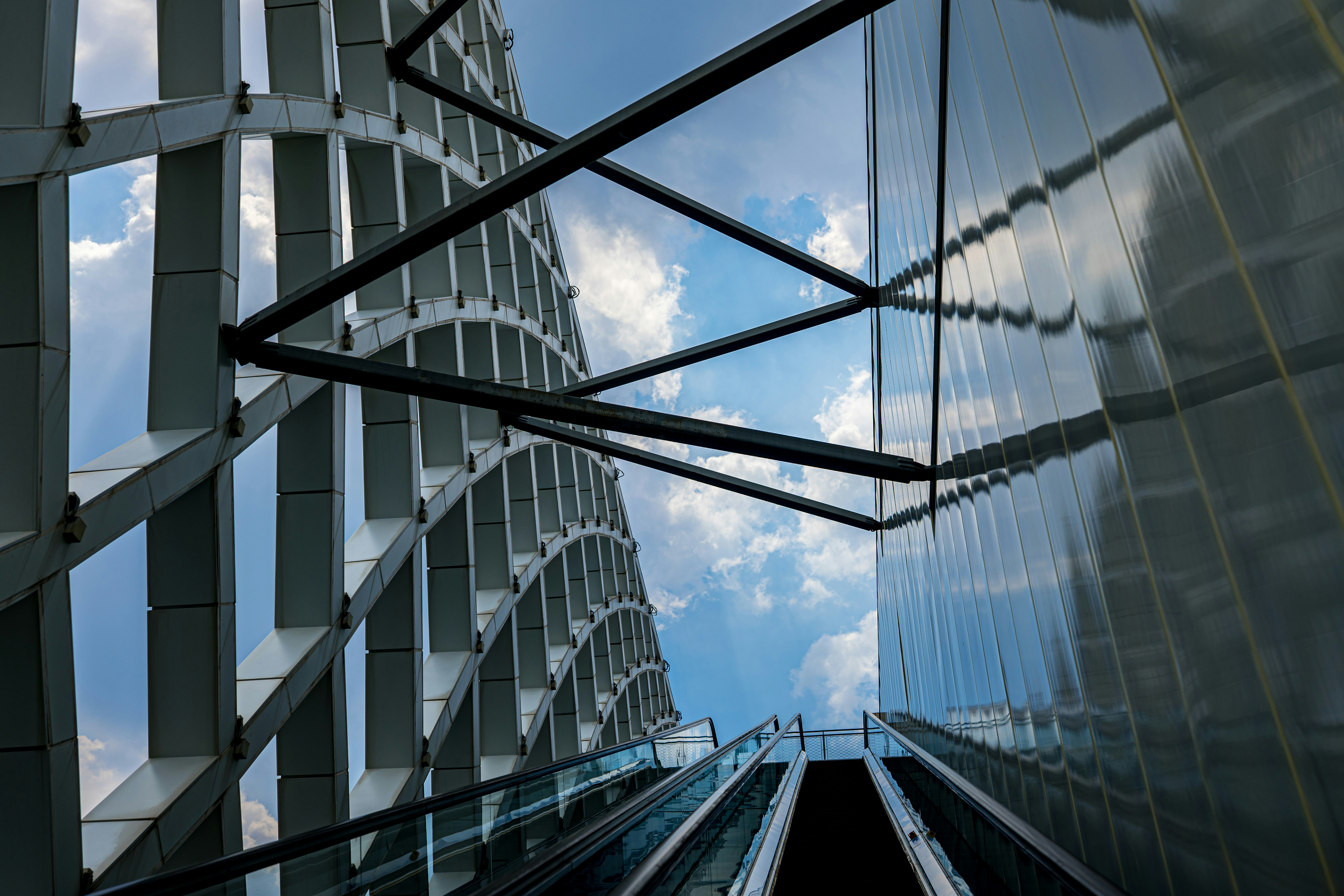 Glass and Steel Convergence: Skyward Lines along a Modern Facade