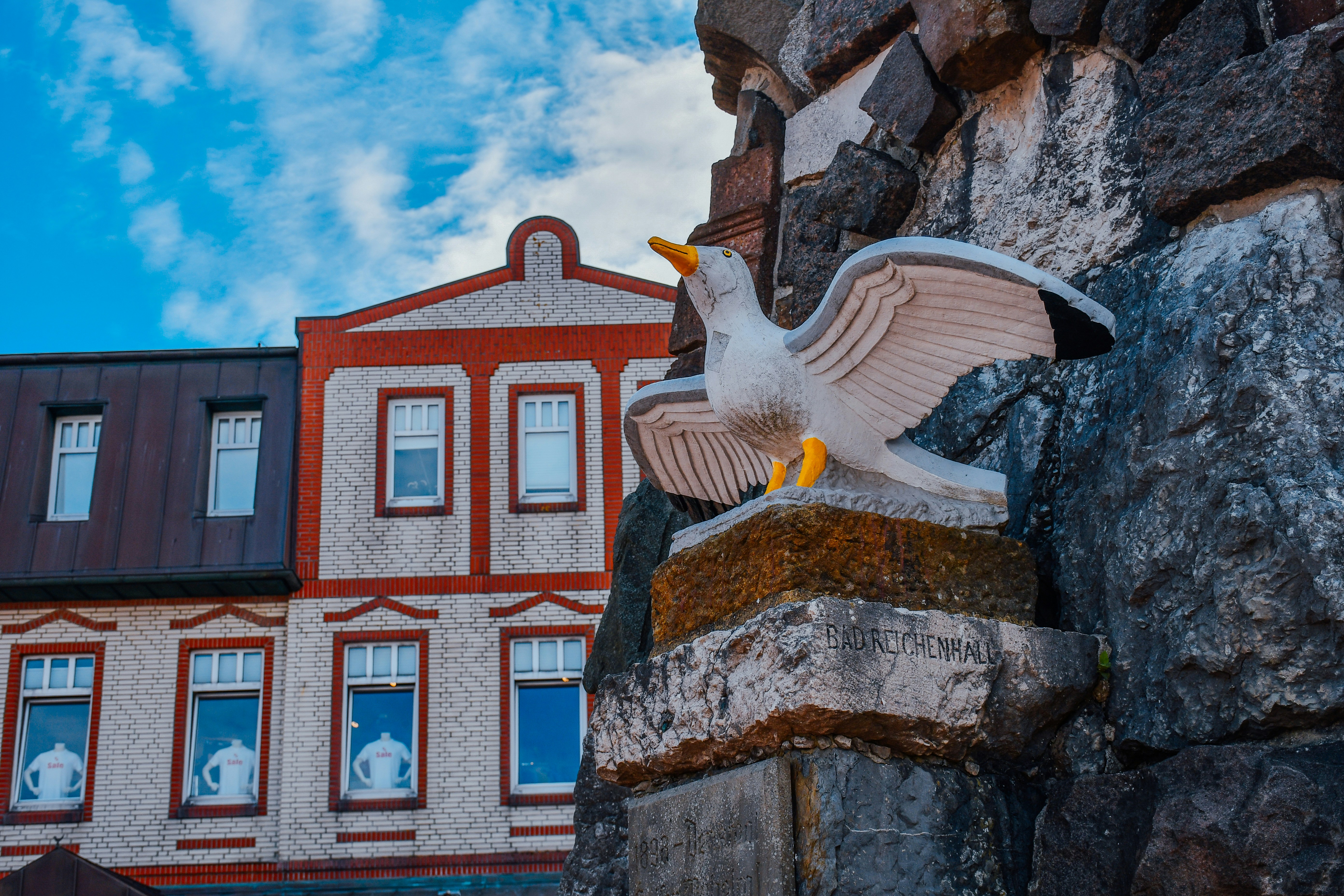 Seagull Sentinel Over a Historic Brick Facade